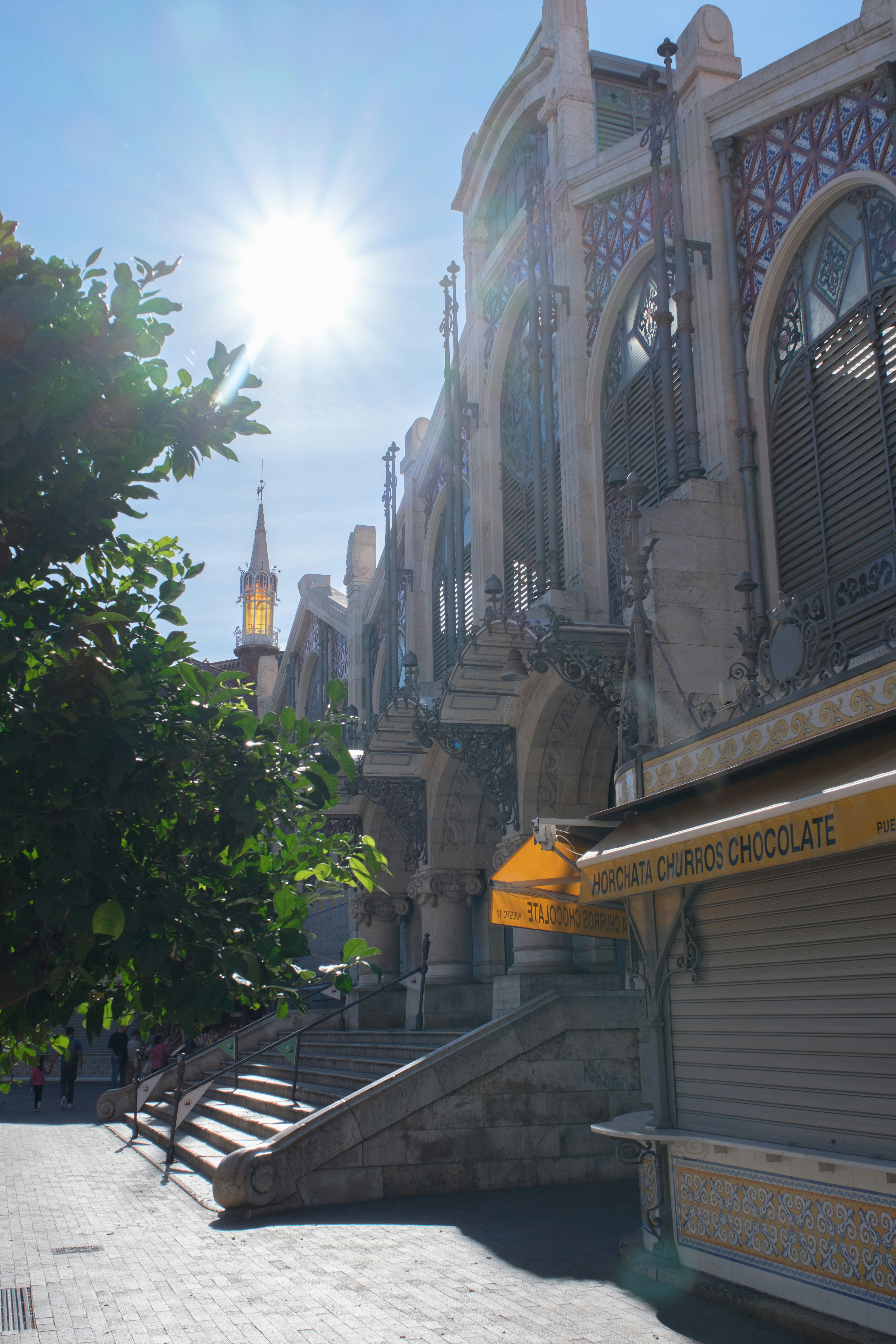 Sunburst Over Stone Arcades: A Narrow Street of Shadowed Steps