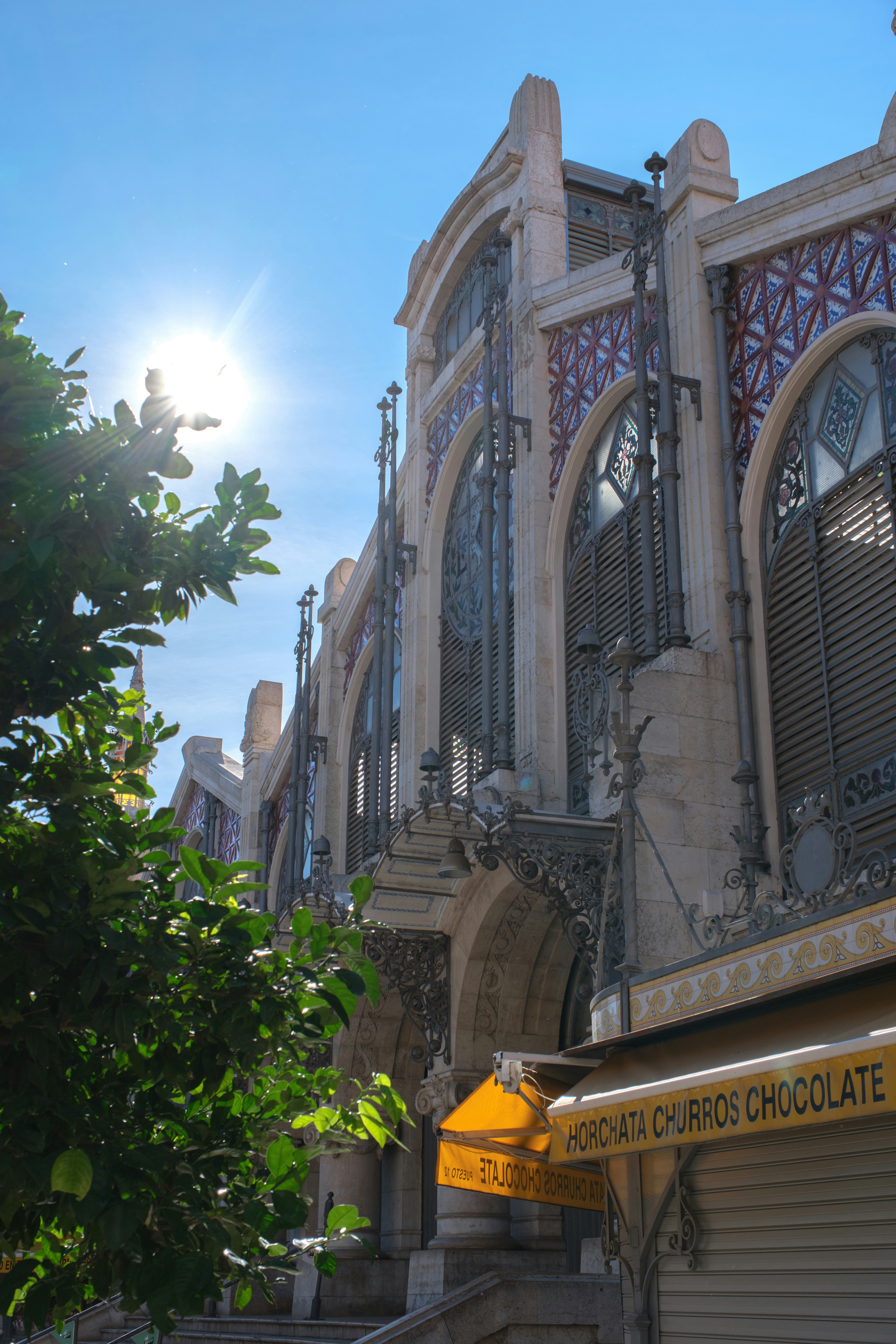 Sunlit Arches and Ironwork: A Street-Level Arcade