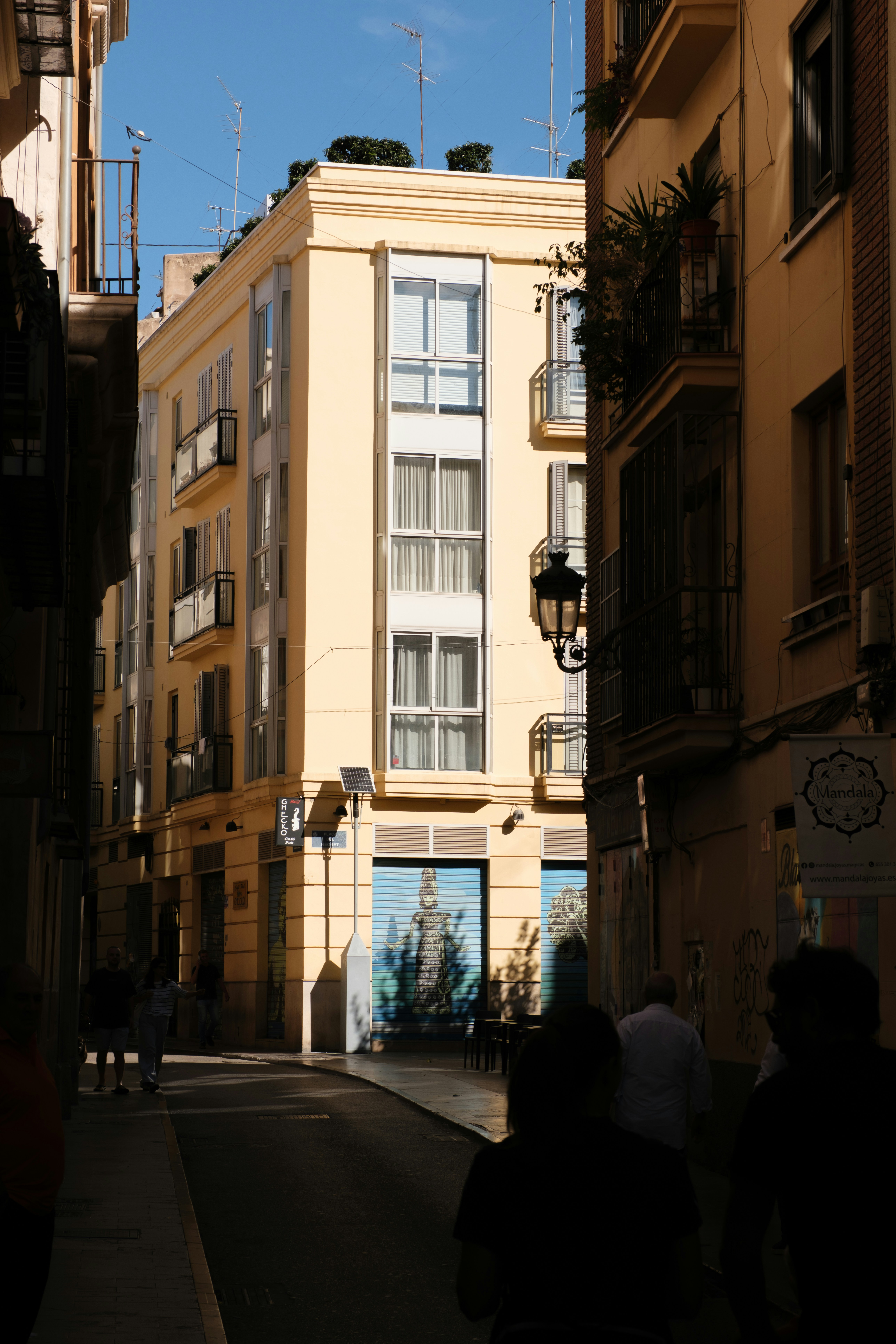 Sunlit Facade Framed by Shadowed Alleys