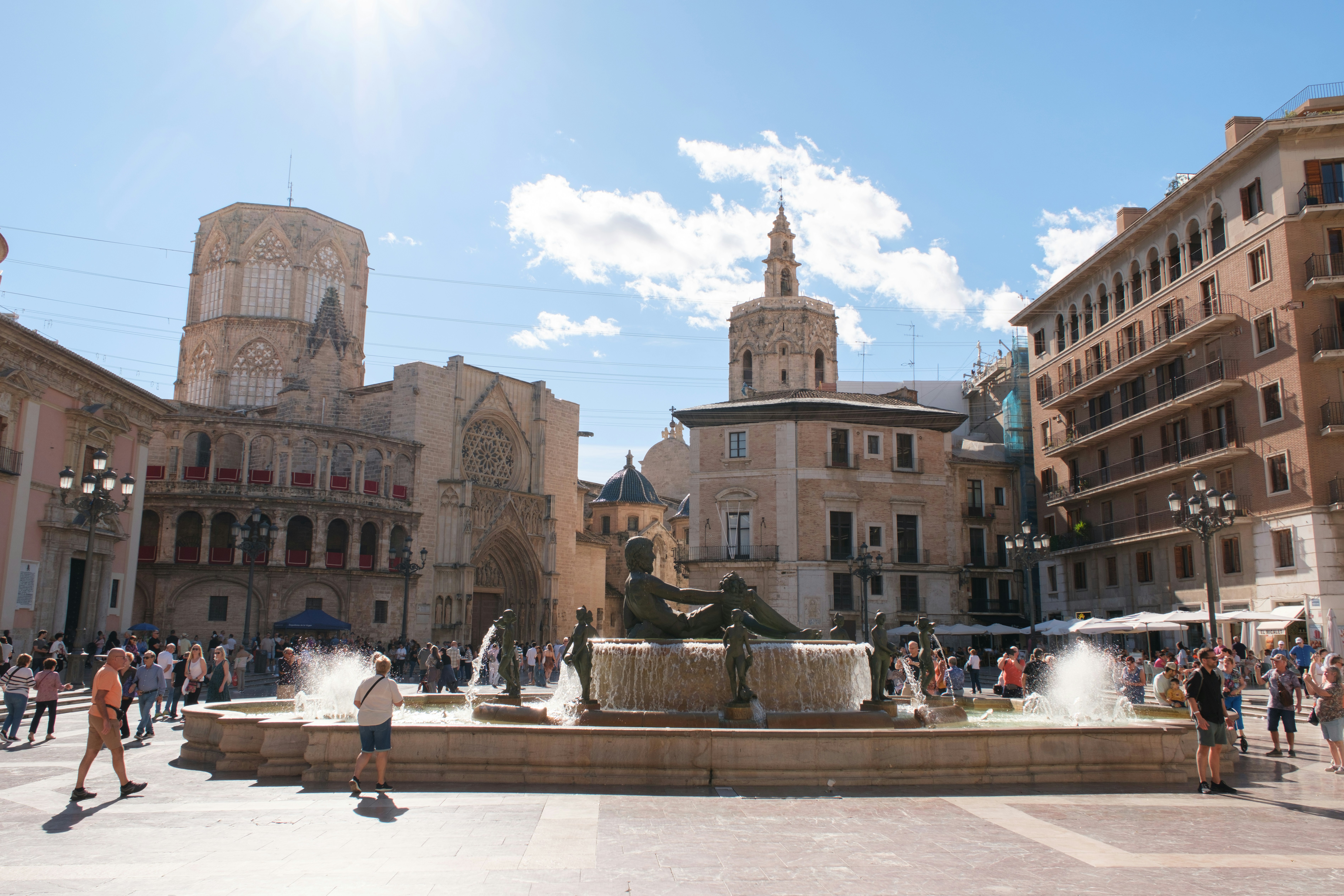Center Fountain Quietly Reigns over a Lively Sunlit Plaza