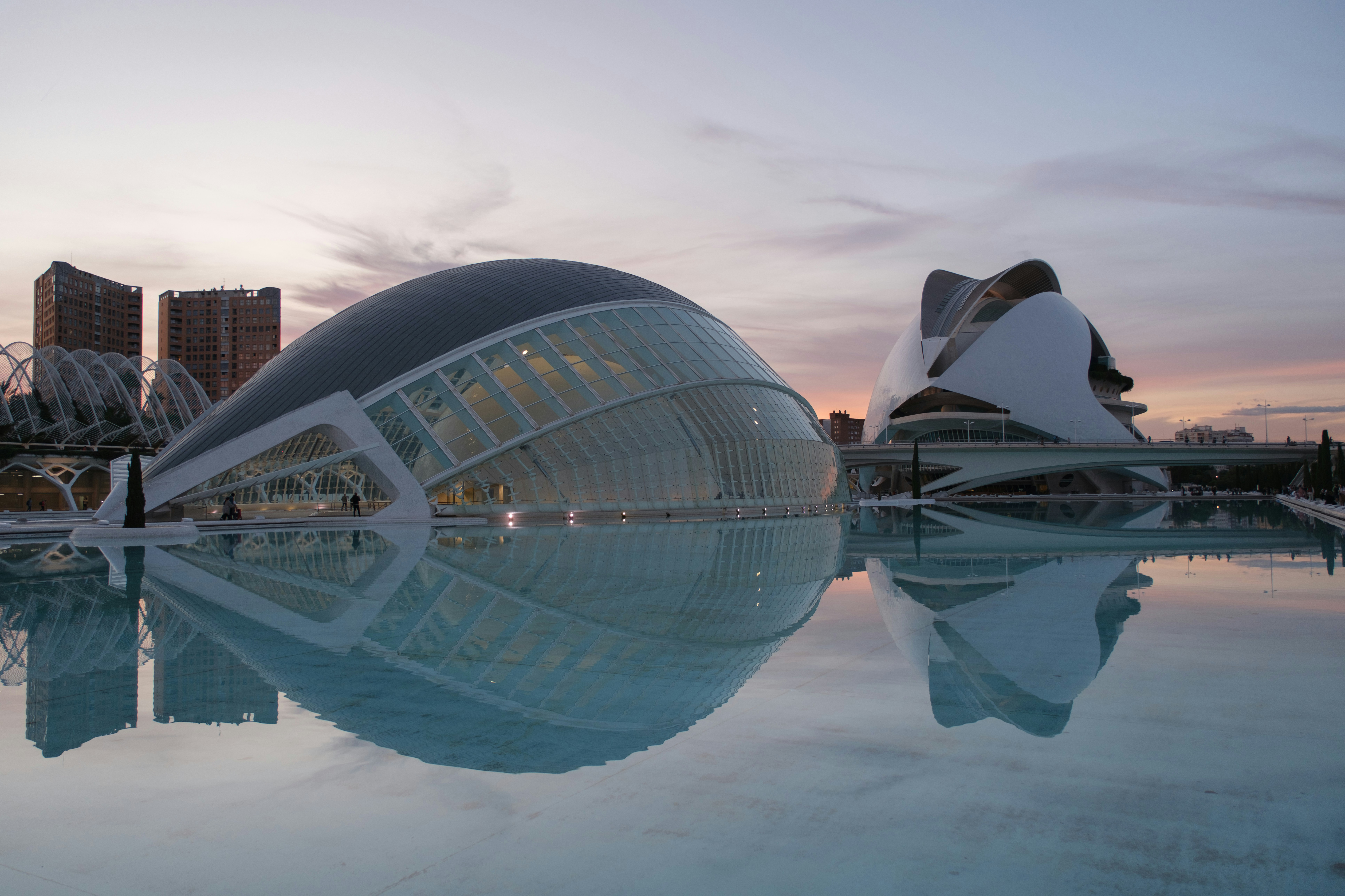 Dusk over Valencia's Glass Canopies: Reflections in Still Water