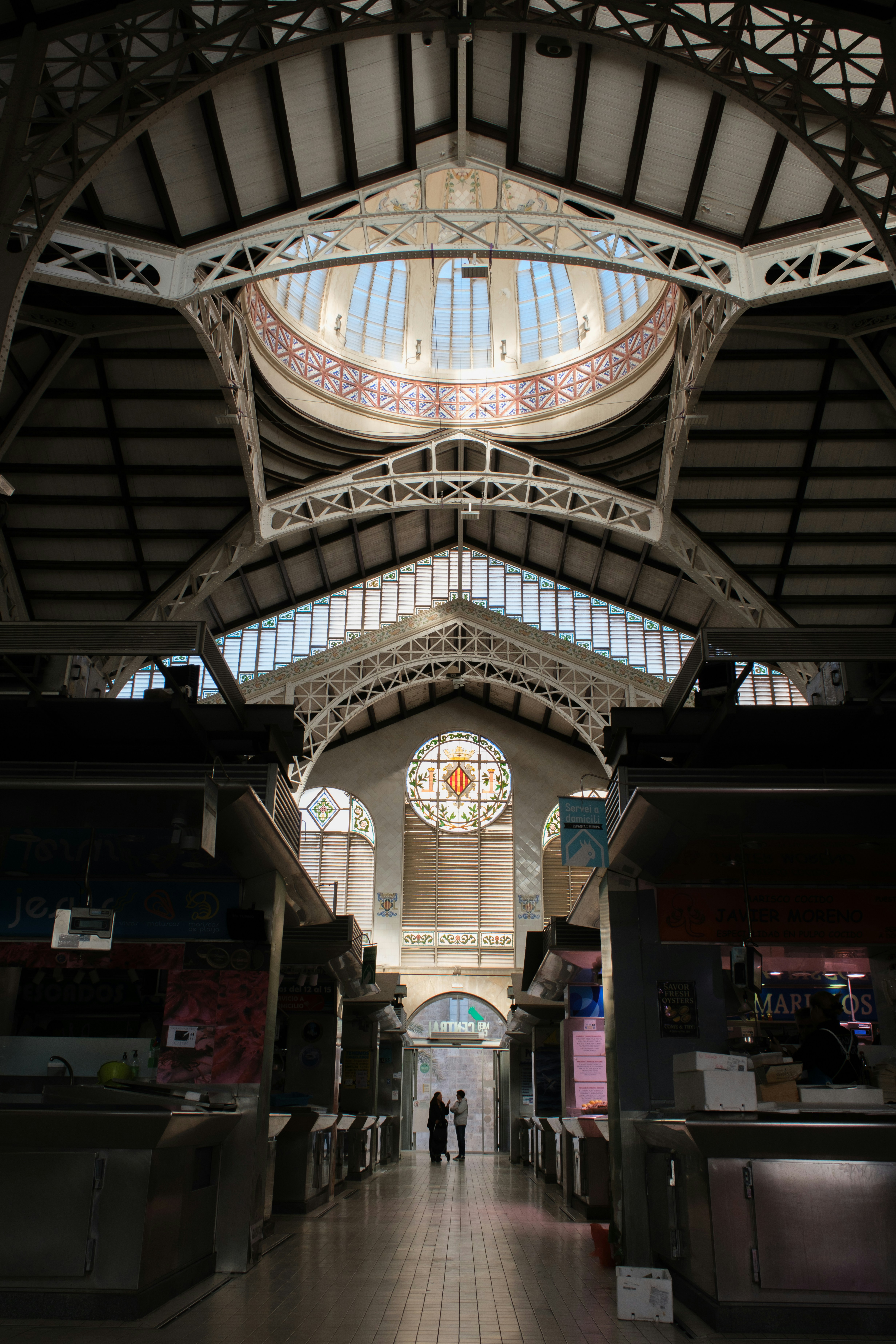Glass Vaults Over Quiet Aisle: Symmetry in a Grand Market Hall