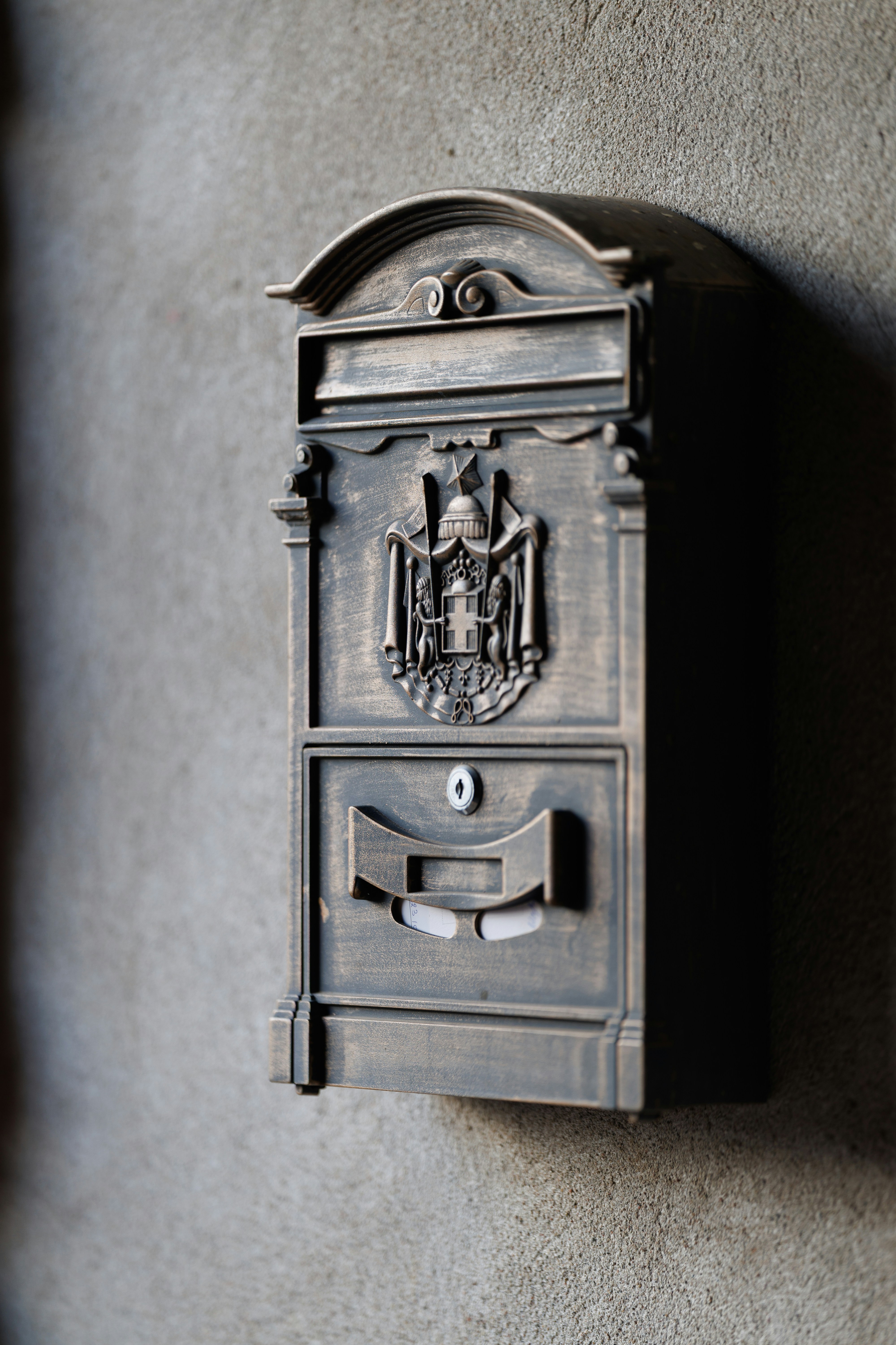 Ornate metal mailbox mounted on a textured wall photo – Free Vintage ...