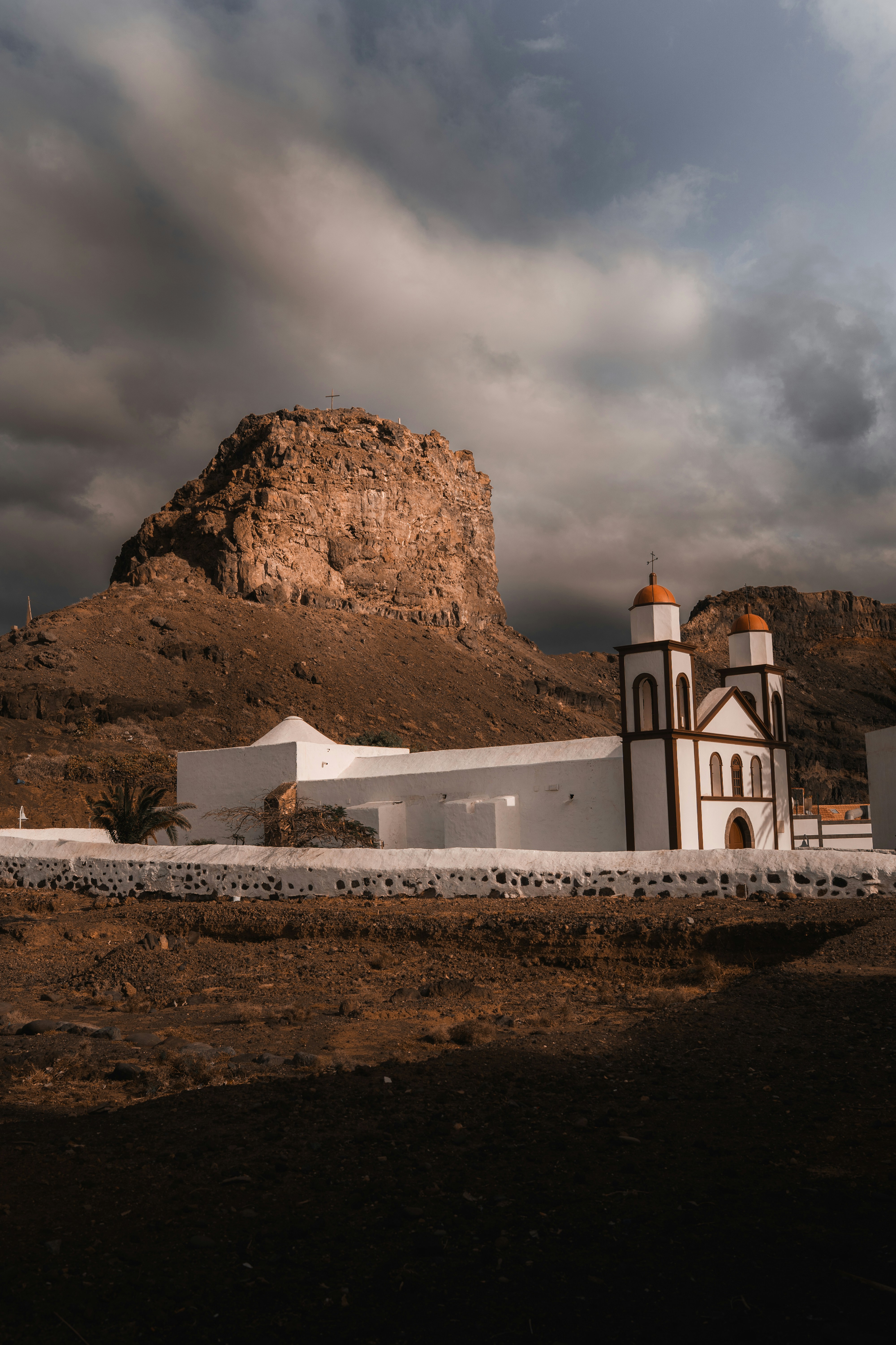 Twin-Domed Chapel at Desert Ridge under Stormy Skies