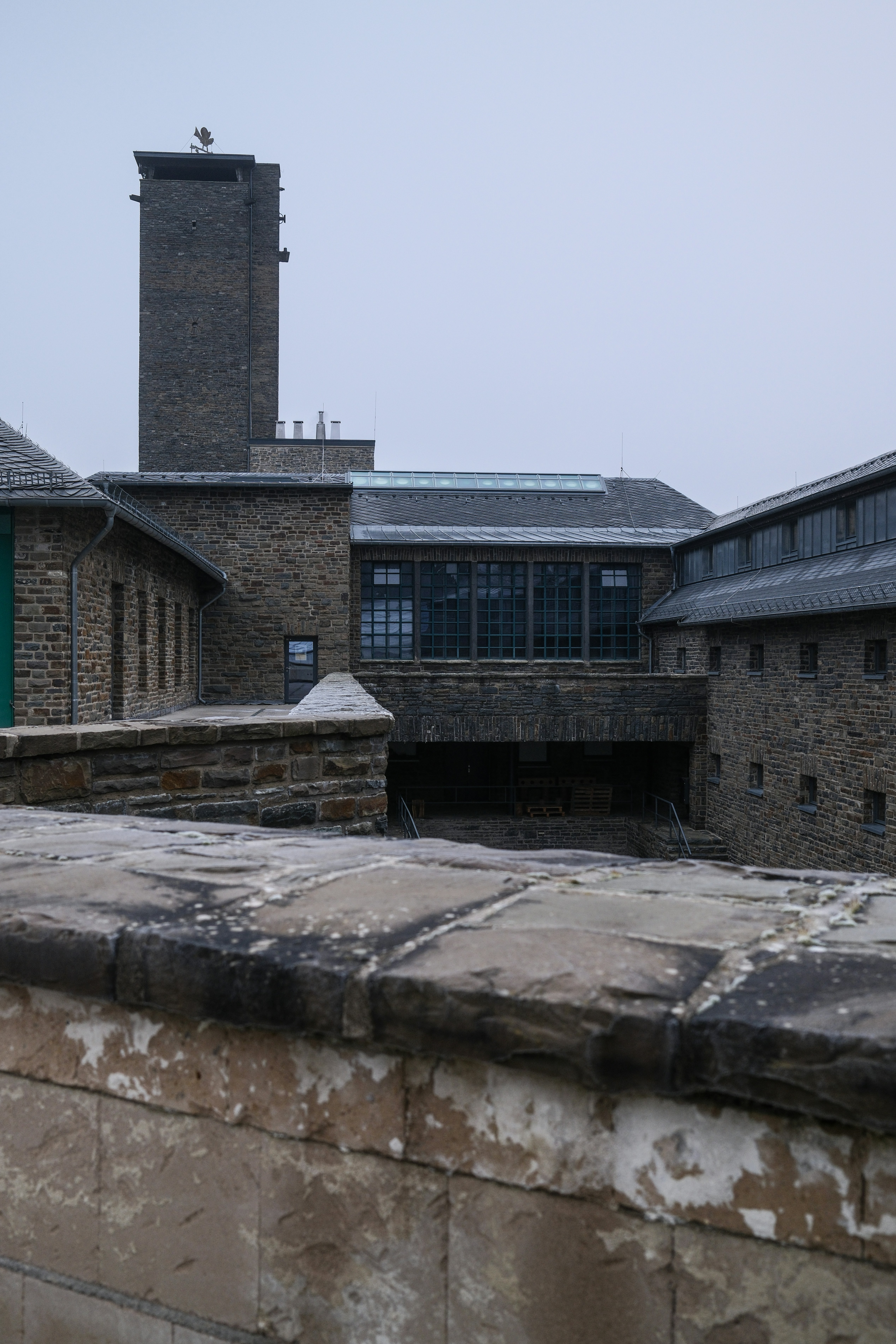 The Sentinel Tower Over a Quiet Brick Courtyard