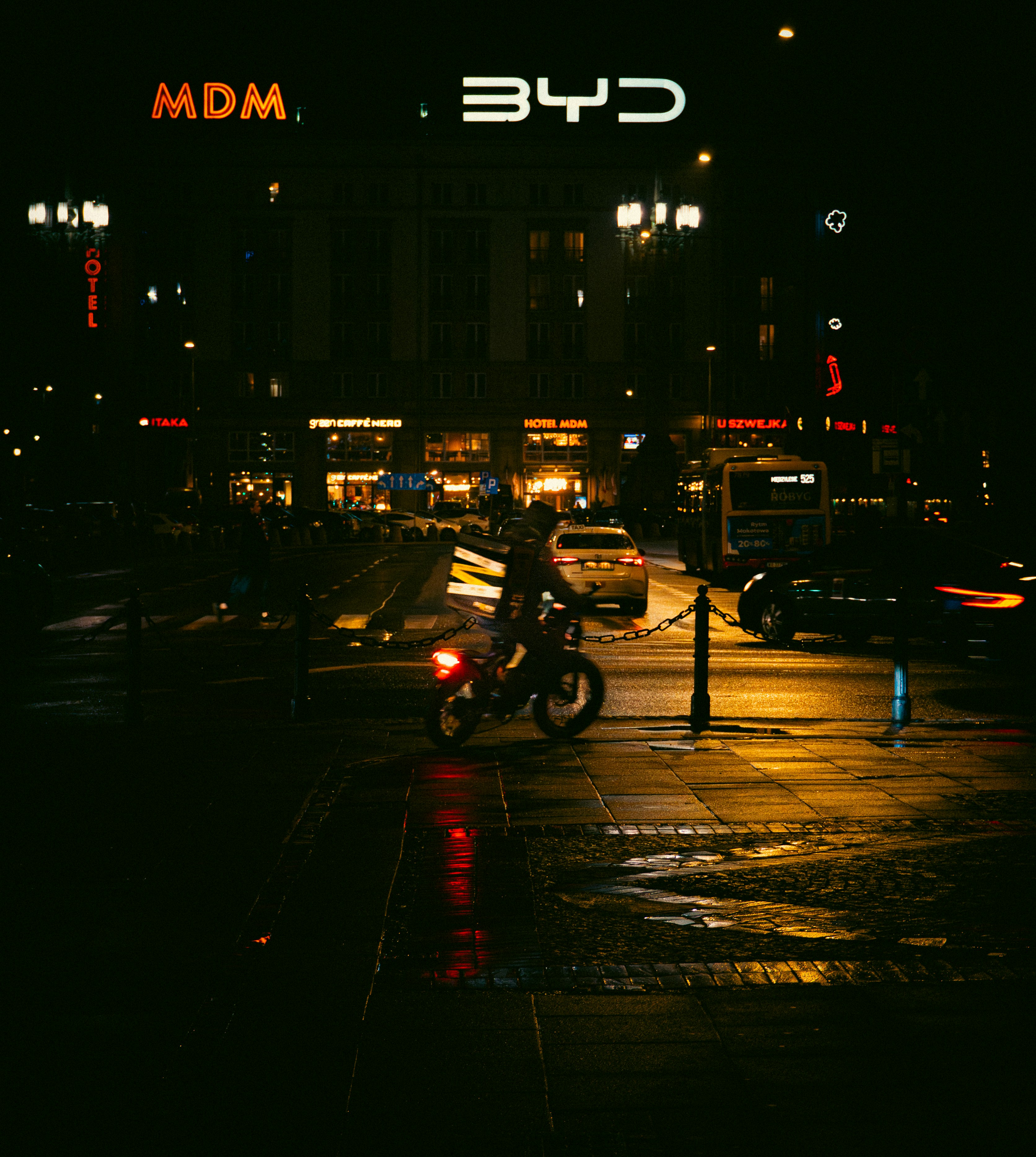 Neon Rain Rider: A Night Glide Through a Wet City Block