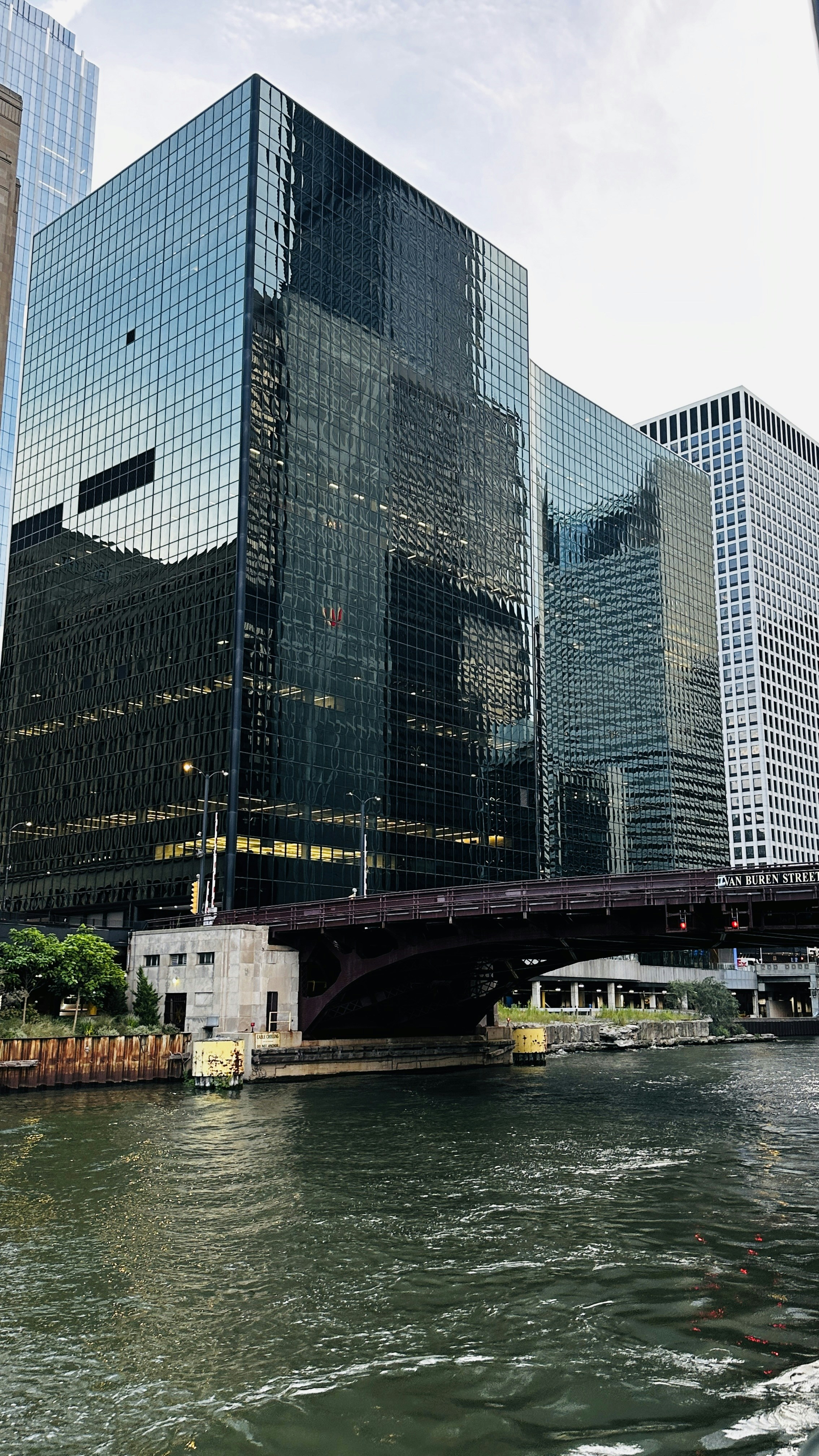 Glass Giants Over the River: A Cityscape Reflection