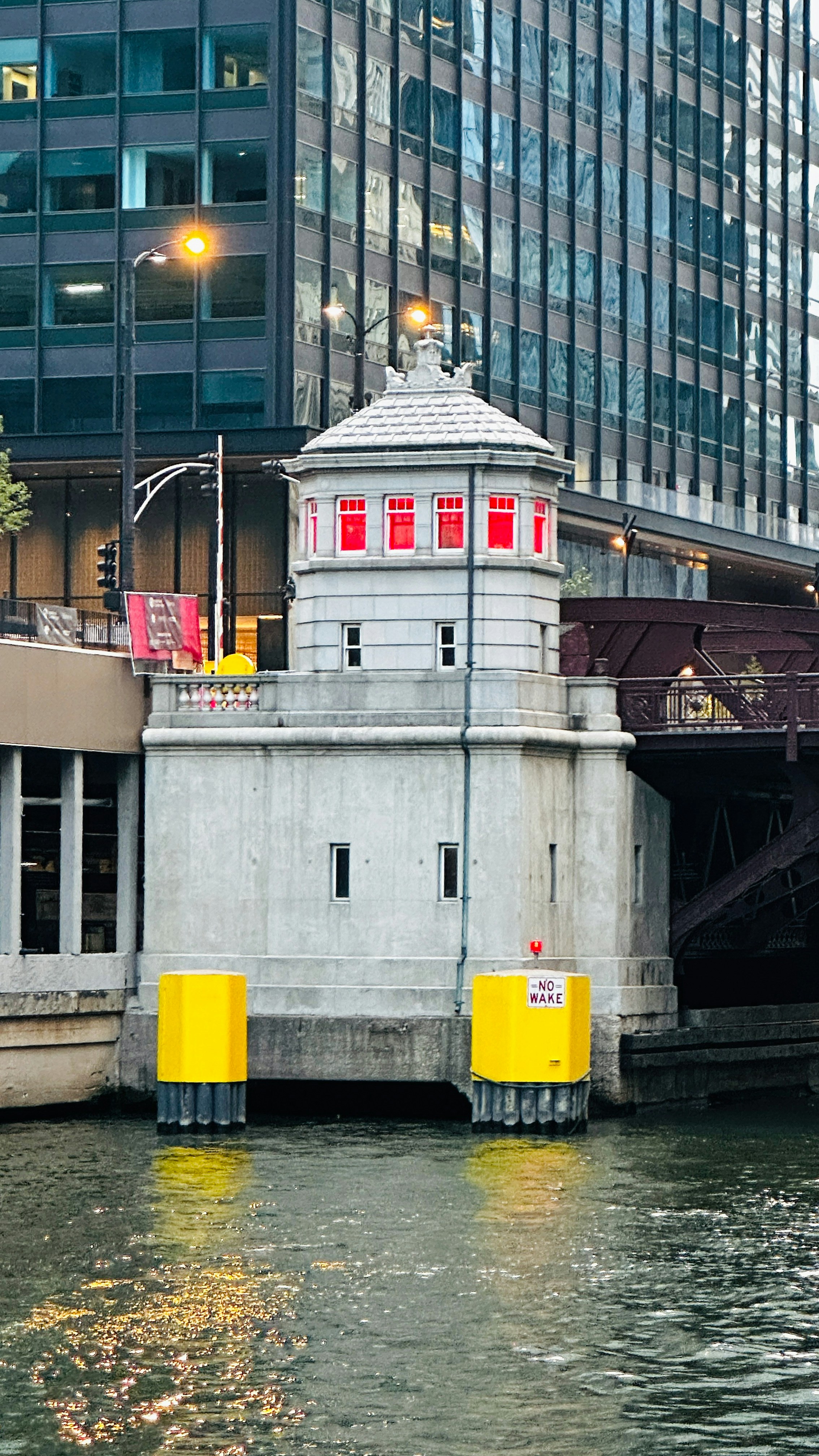 Waterfront Sentinel: The Little Turret Amid Sky-High Glass
