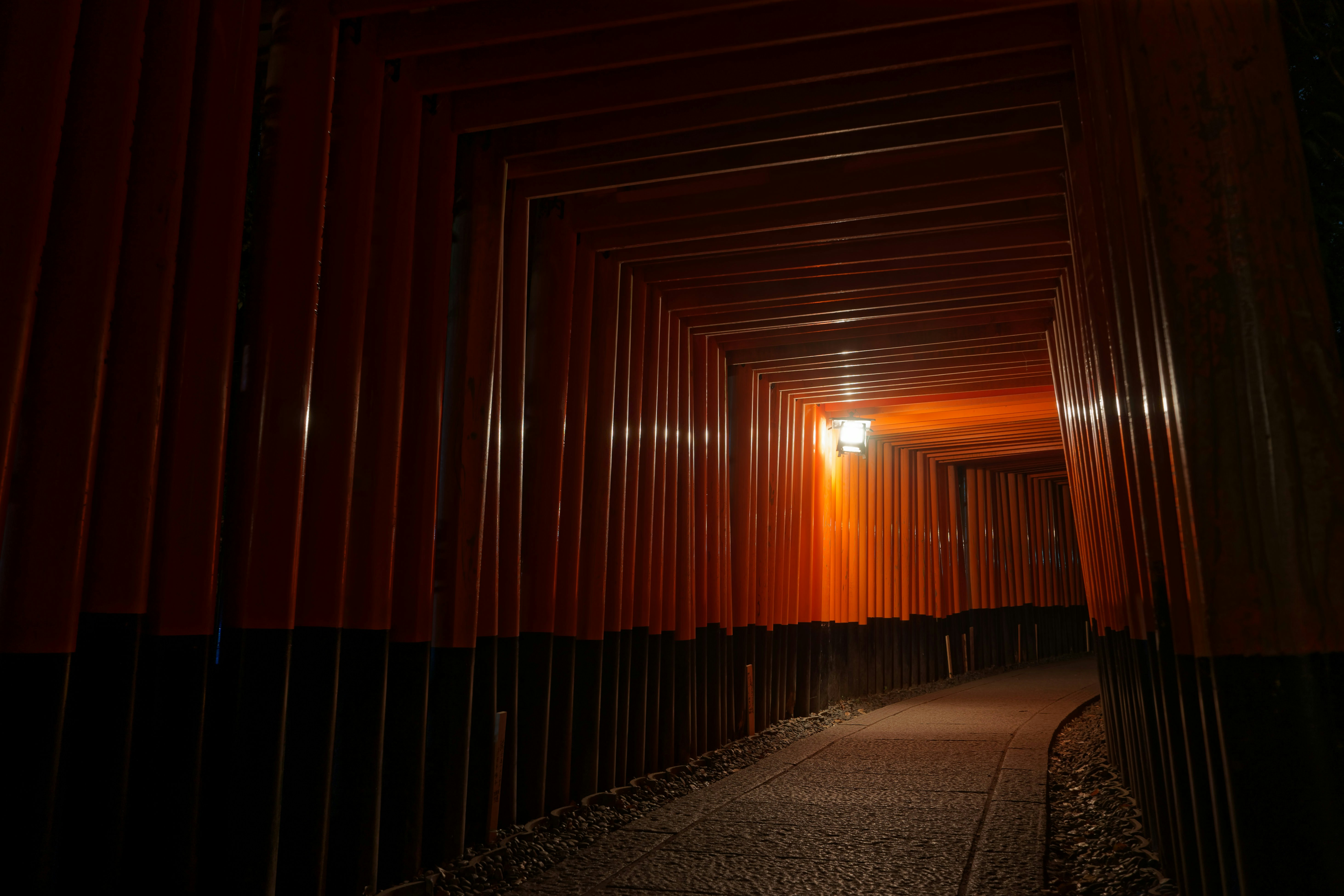 Crimson Torii Corridor Reaching a Golden Exit