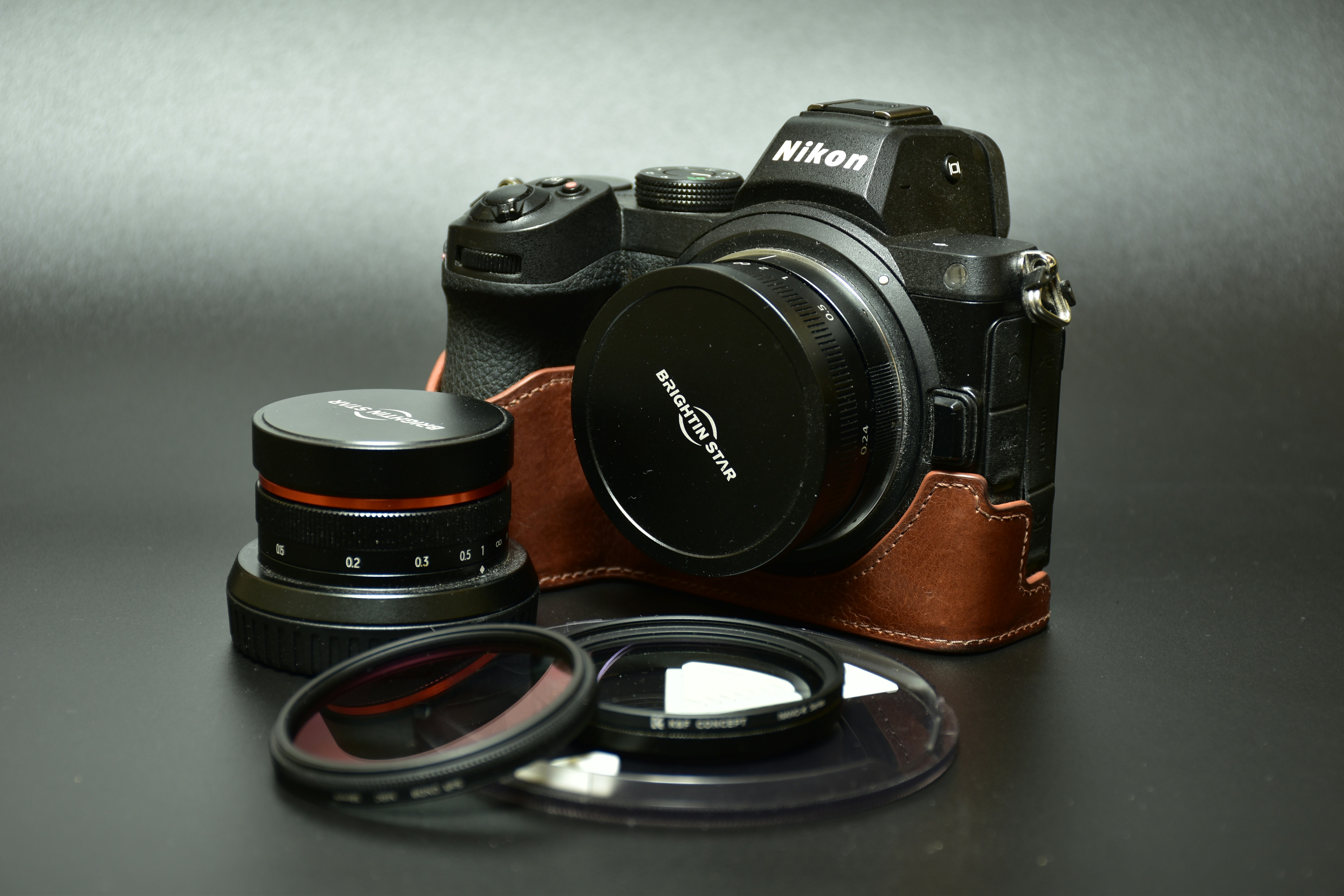 Nikon camera with lenses and filters on dark background photo – Free ...