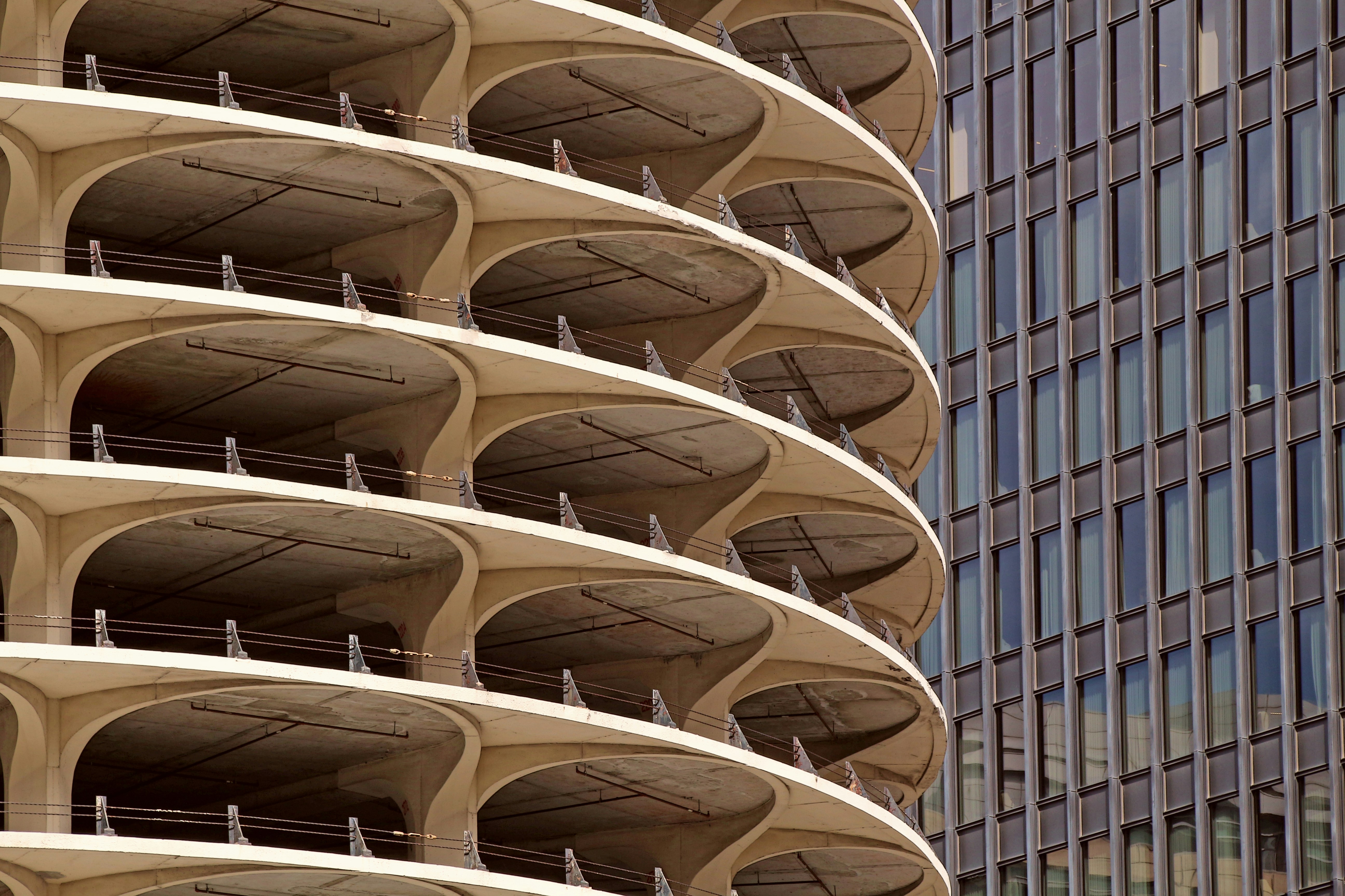 Spiral Balconies Against a Glass-Grid Skyline