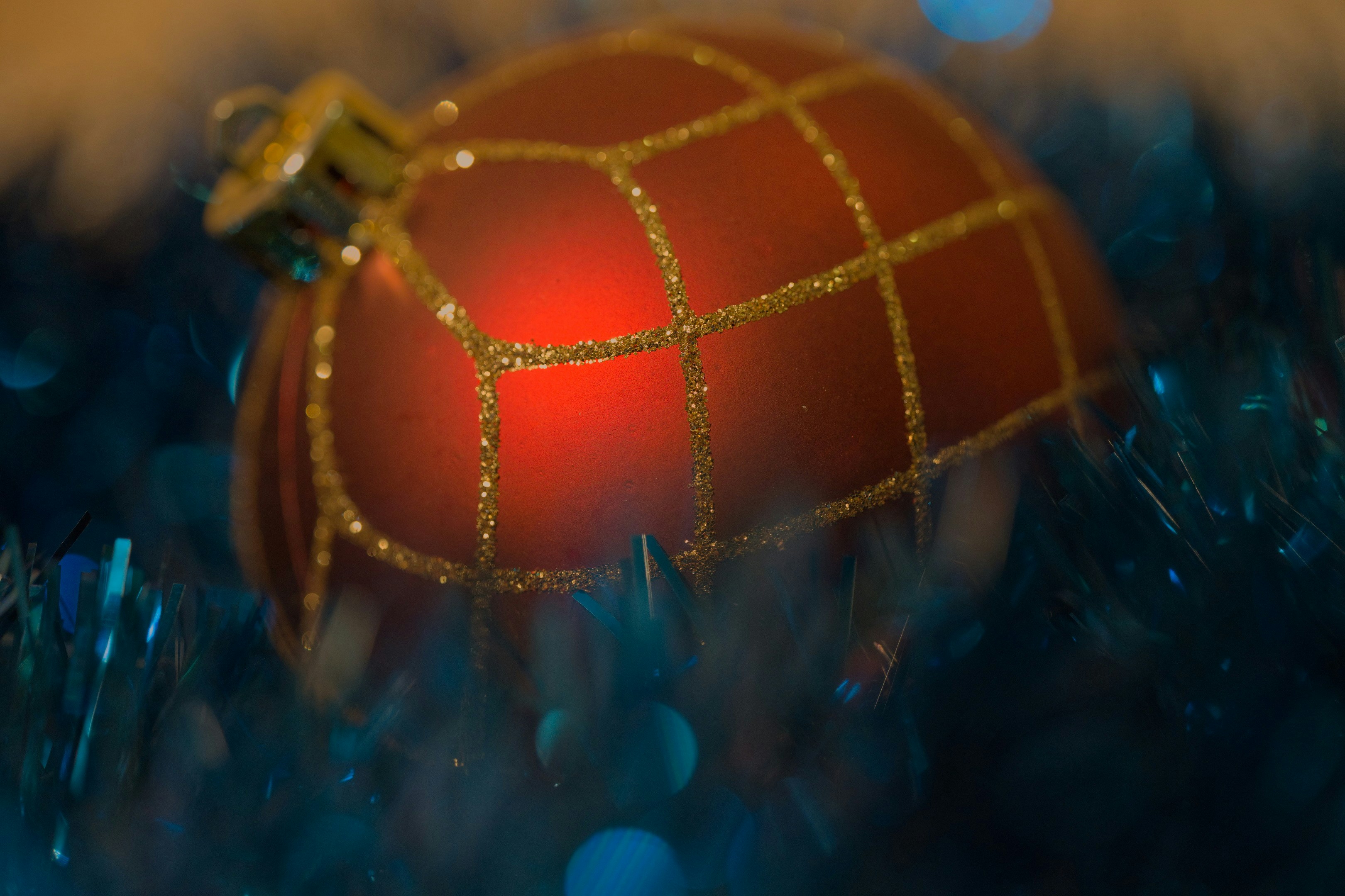 Crimson Christmas Bauble Surrounded by Azure Sparkle