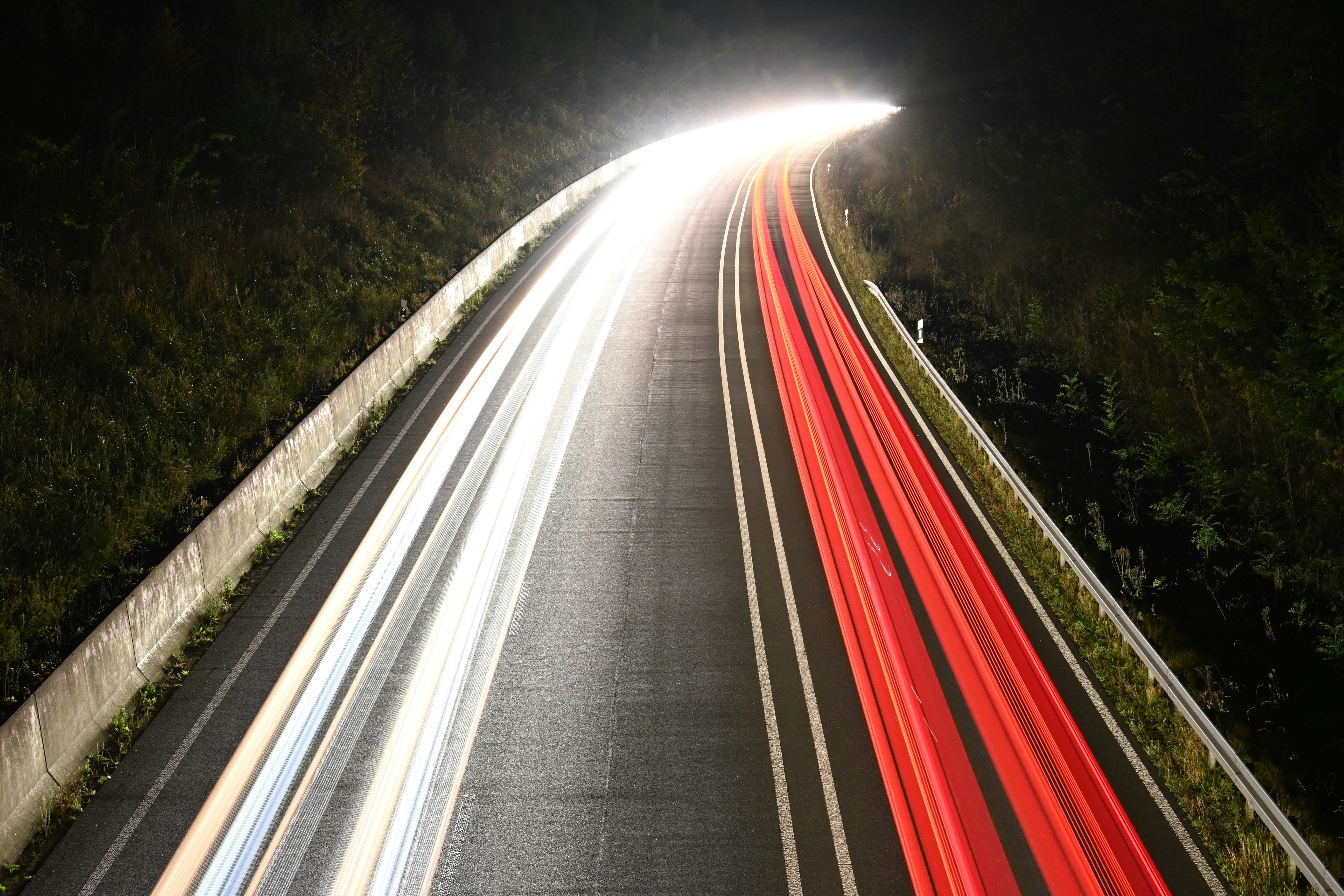 Arc of Light Over a Winding Night Highway