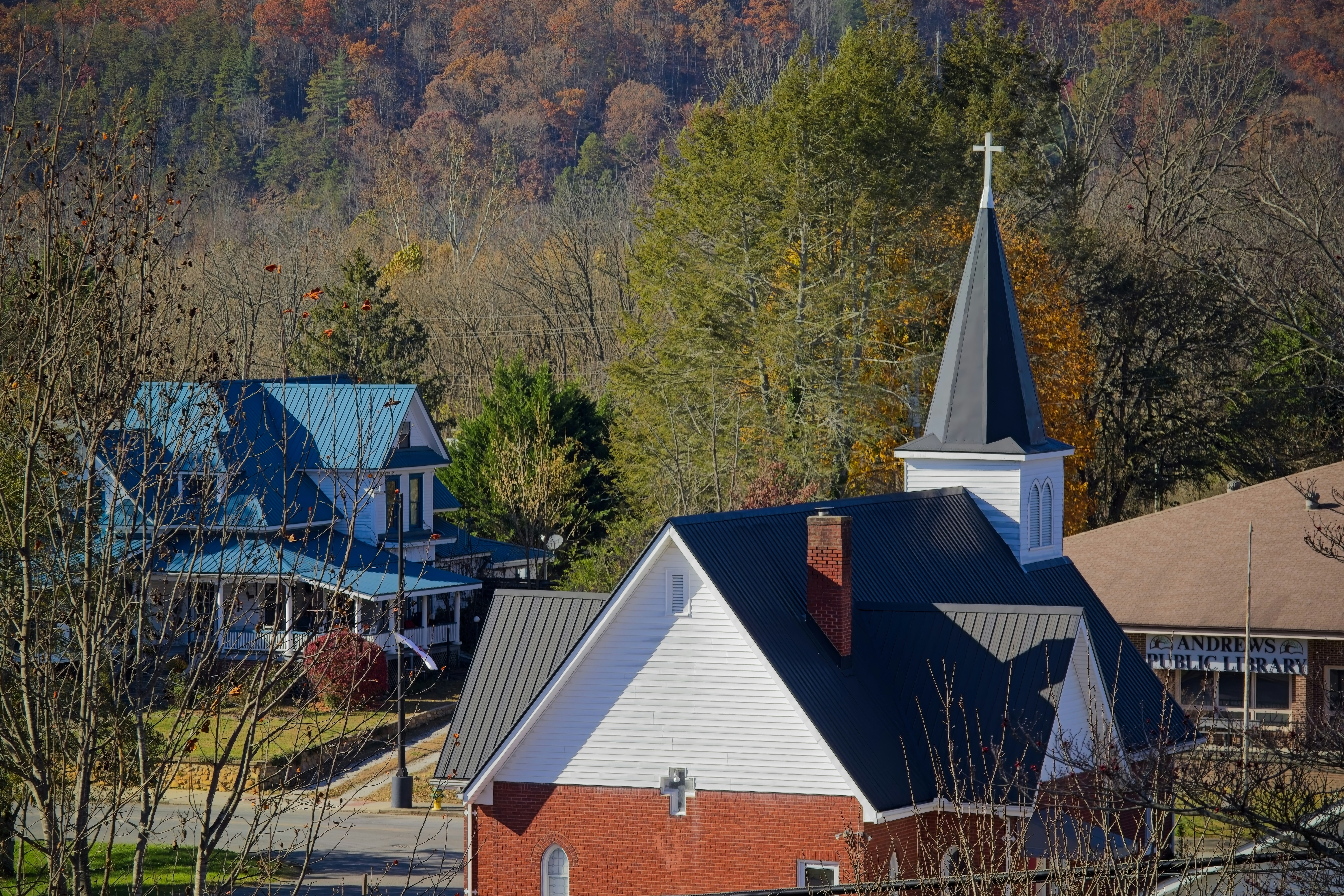 Steeple and Fall: A Quiet Church Surrounded by Autumn Color