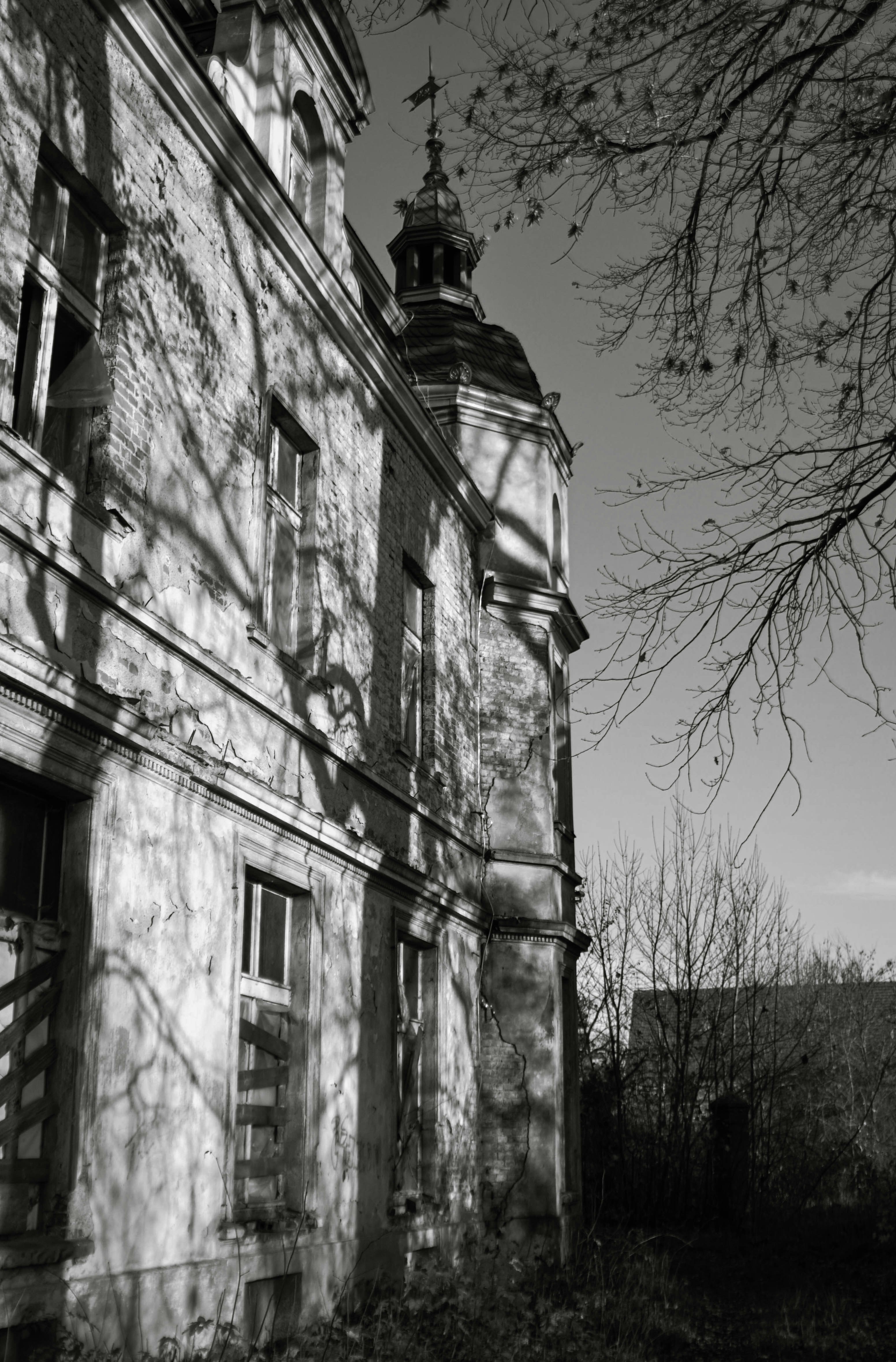 Turreted Corner under Shadow: A Monochrome Study of a Historic Façade