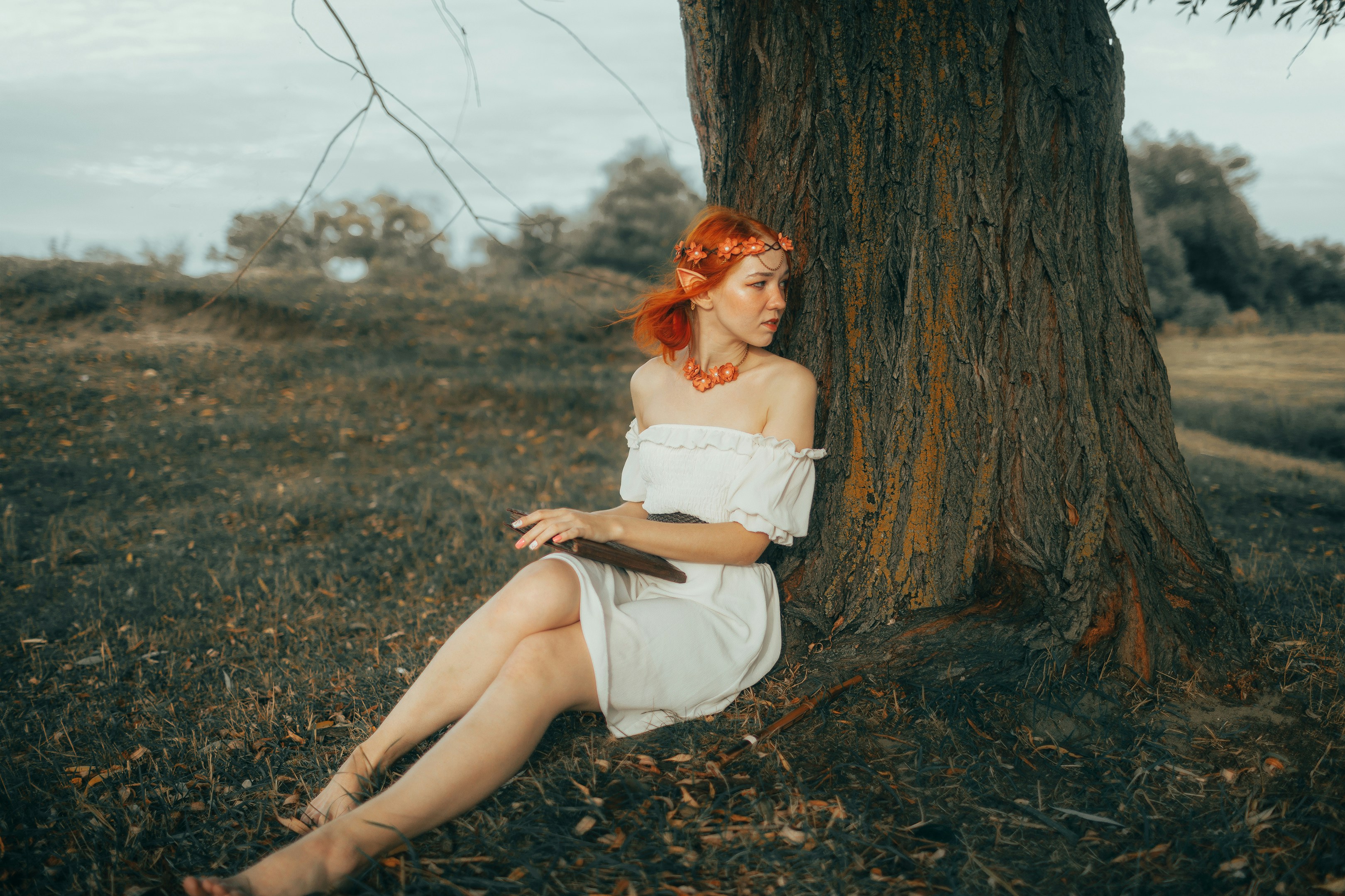 Red-haired woman in white dress sitting by tree photo – Free Grass ...