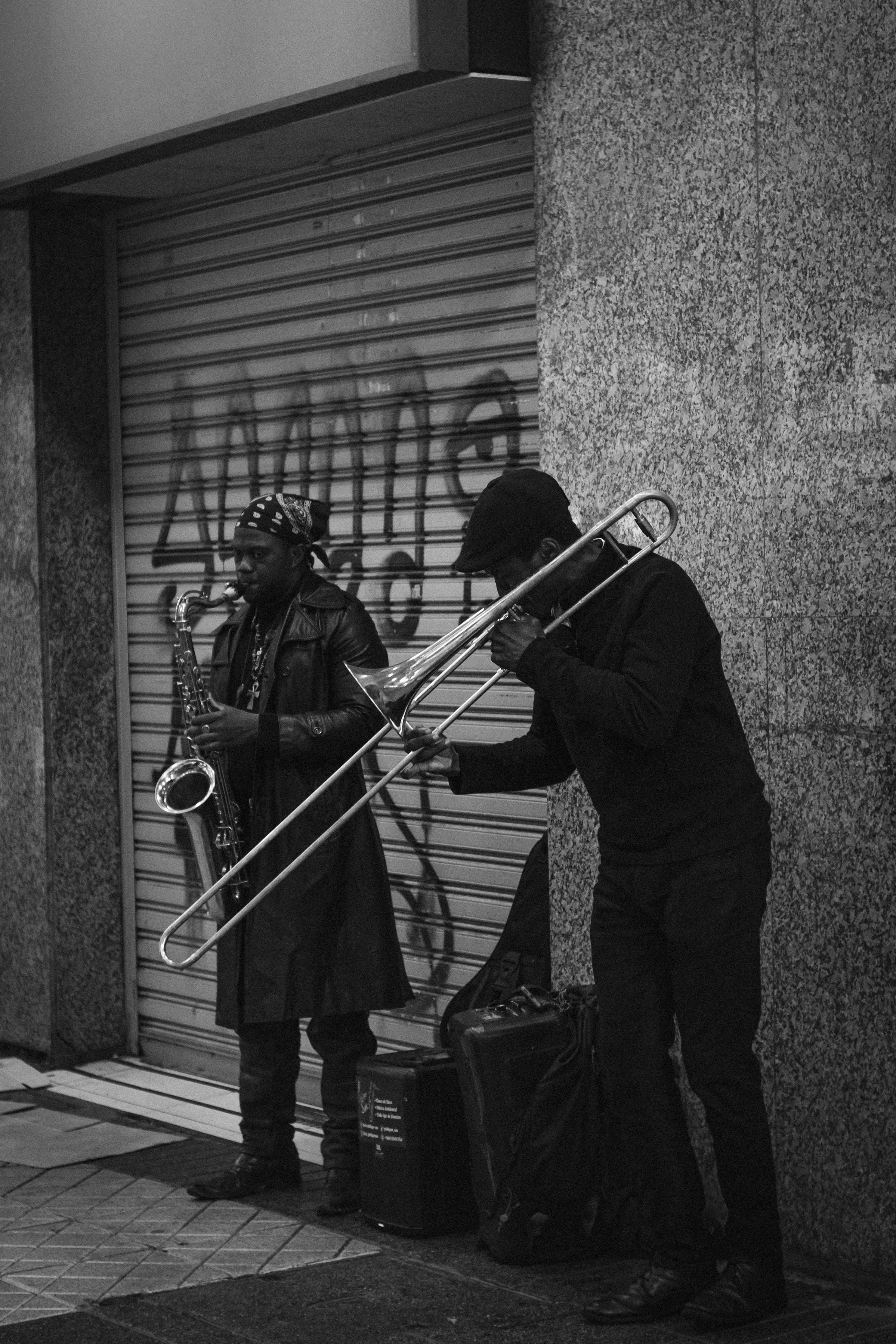Noir Groove on the Sidewalk: Sax and Trombone in Graffiti's Shadow