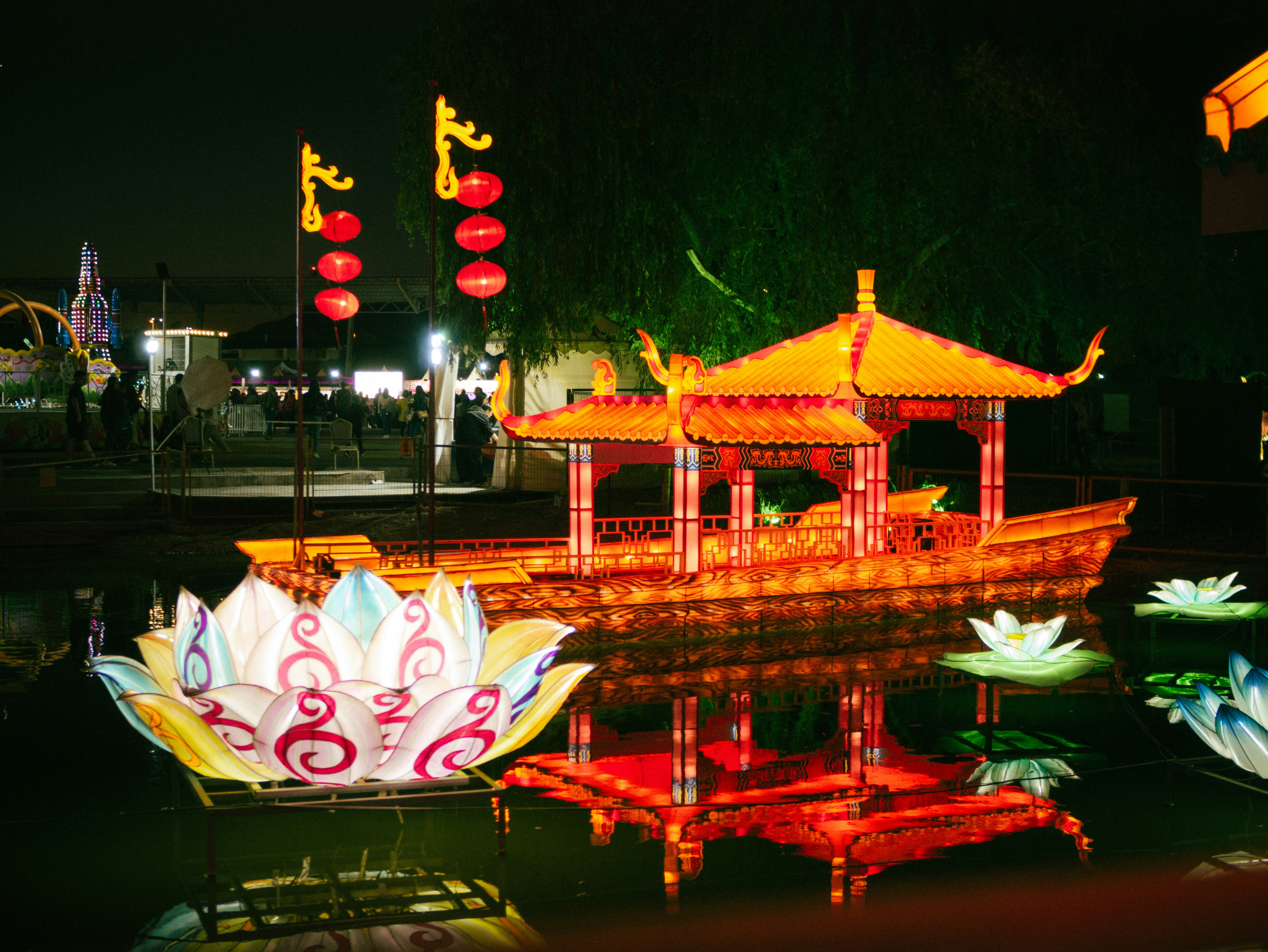 Neon Lantern Pagoda on a Reflective Canal