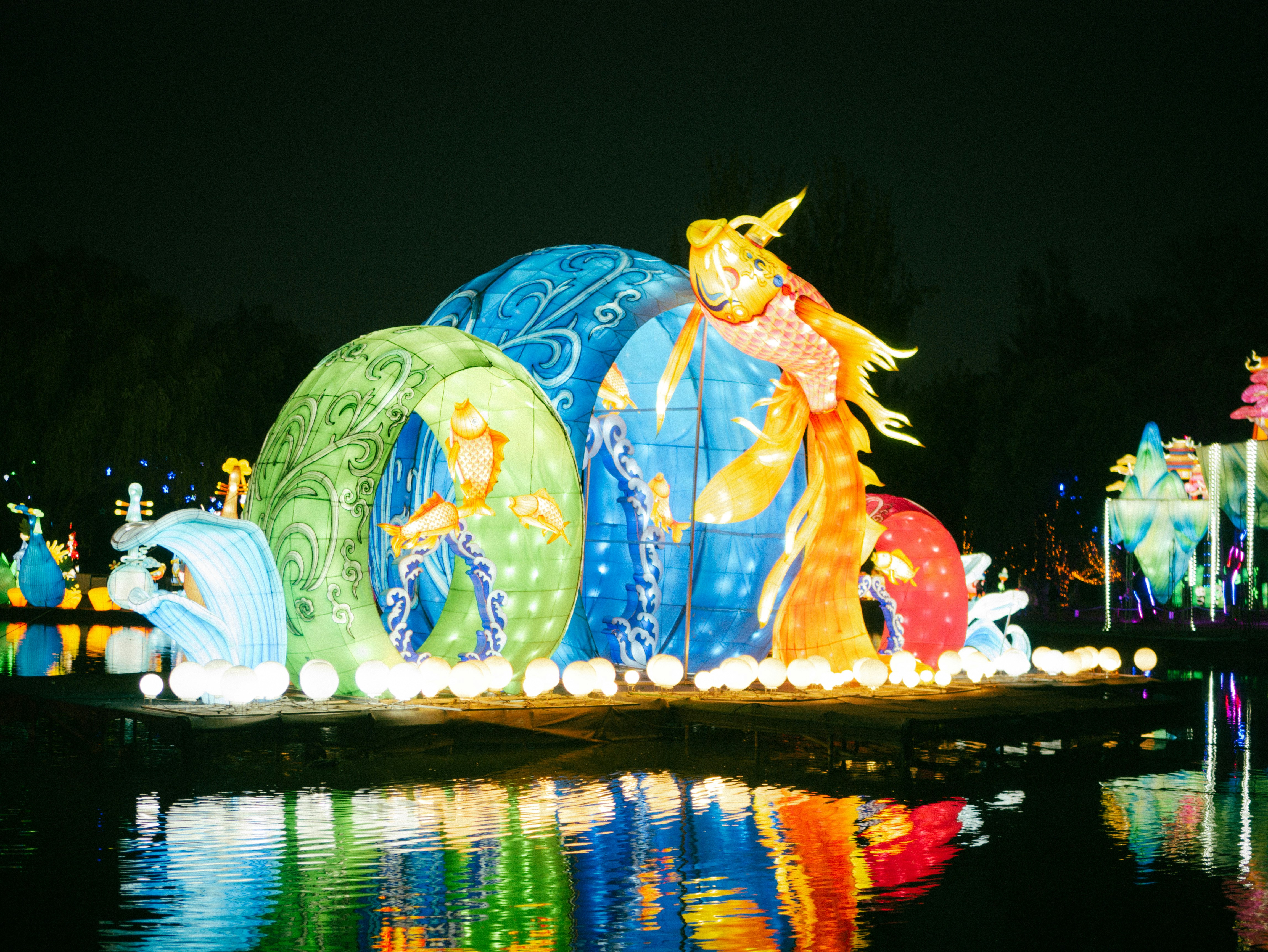 Neon Dragon Parade Across Moonlit Water
