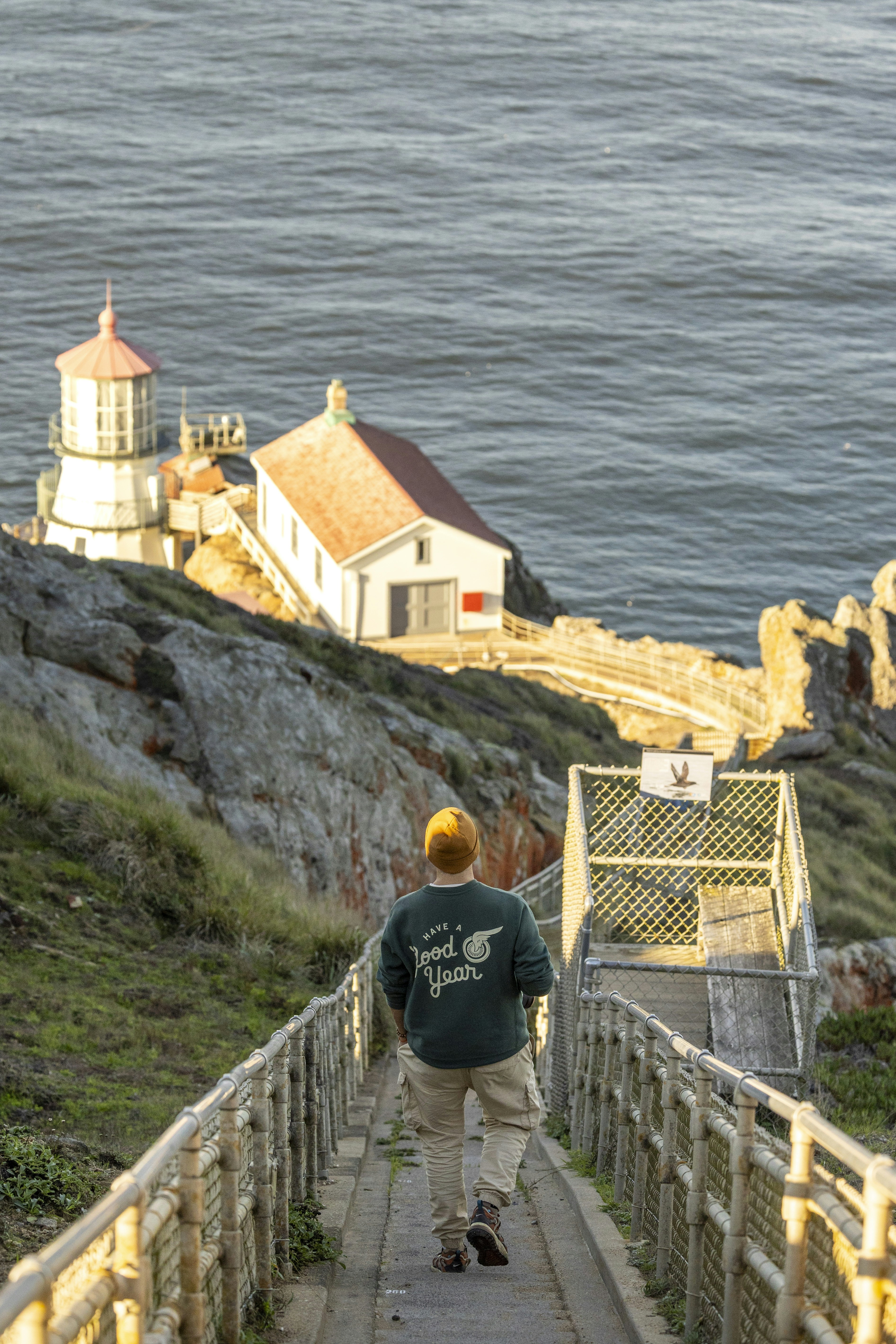 Cliffside Footpath Toward a Seaside Lighthouse