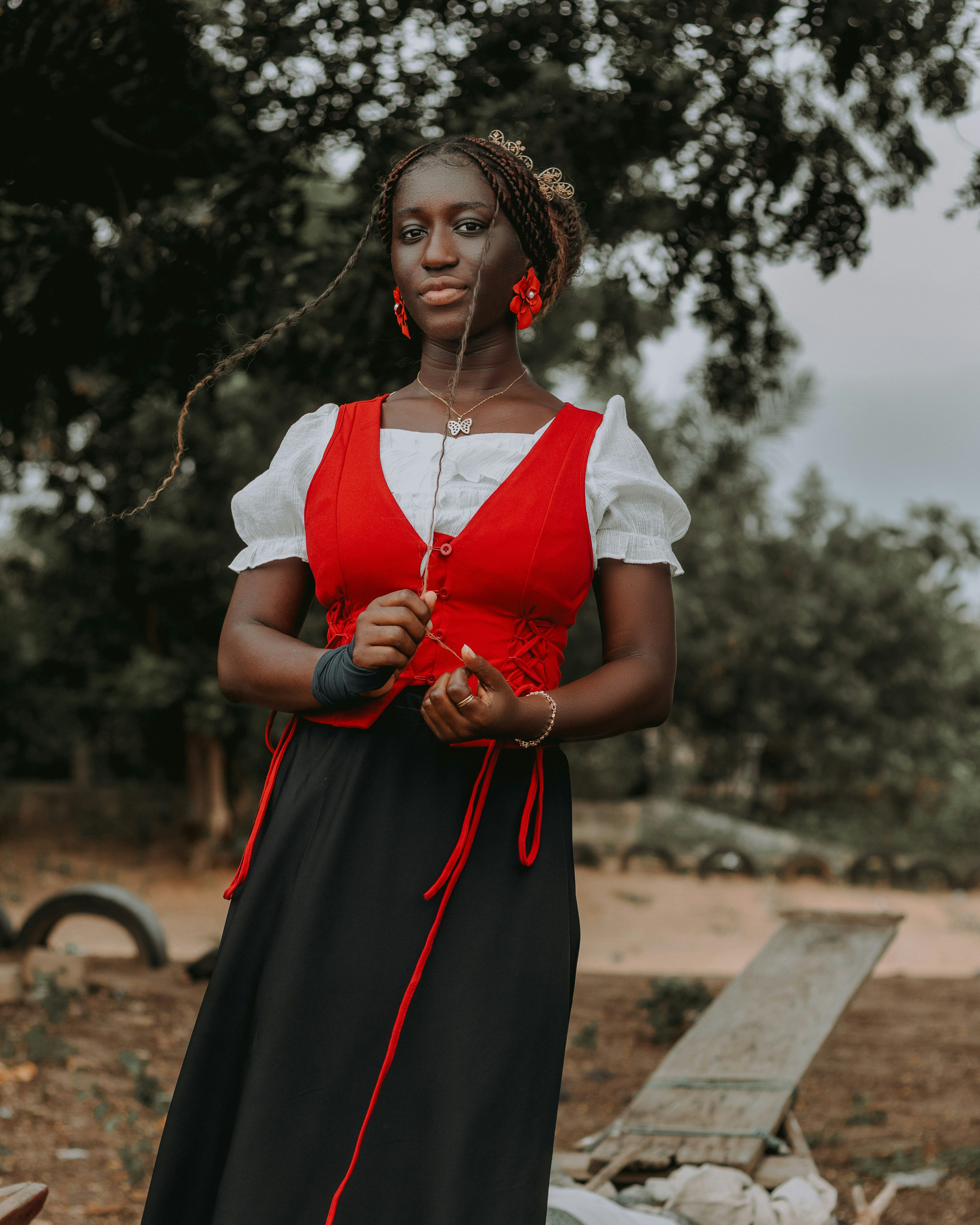 Crimson Vest Portrait in a Quiet Outdoor Glade