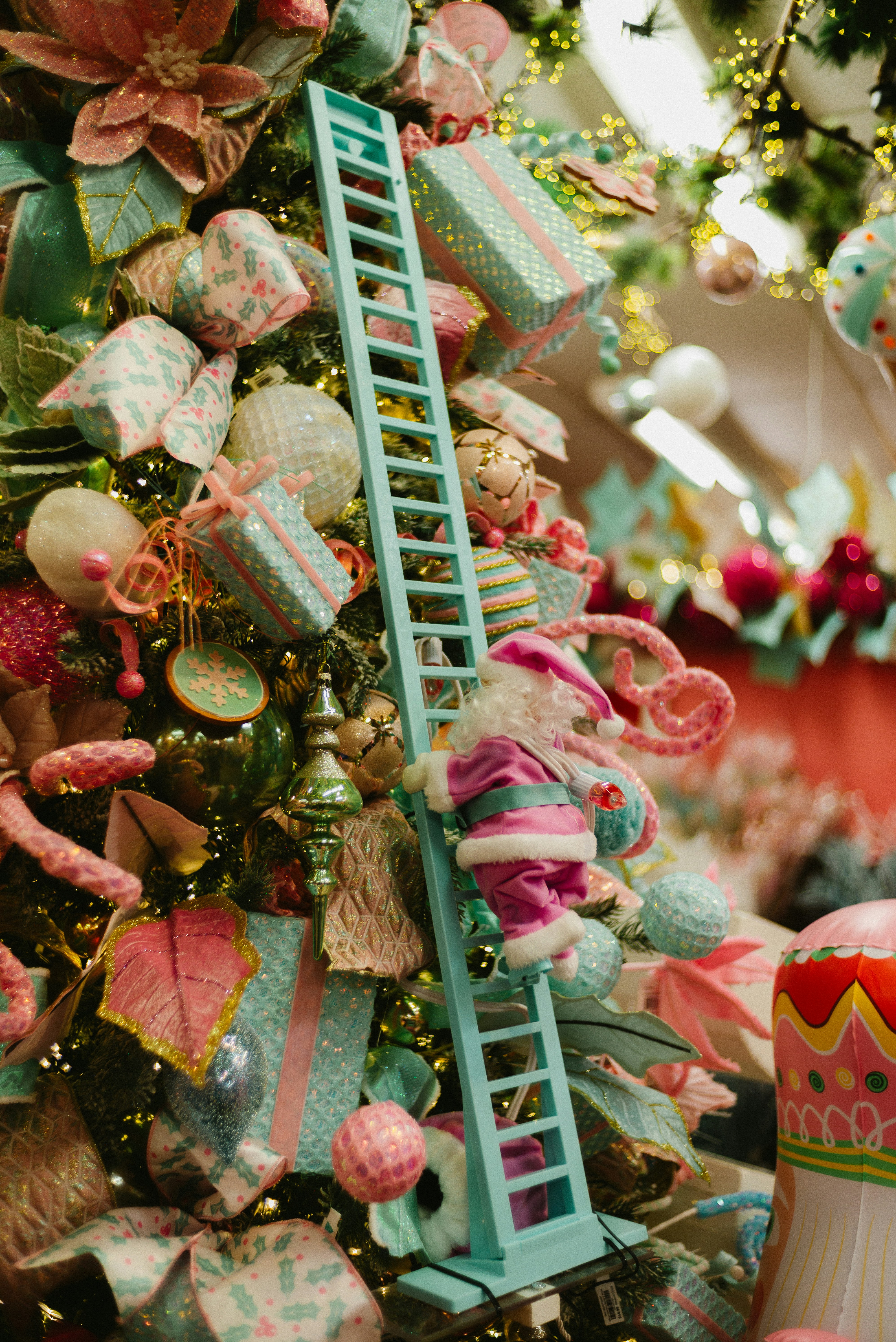 Teal Ladder Climbing a Candy-Colored Christmas Tree