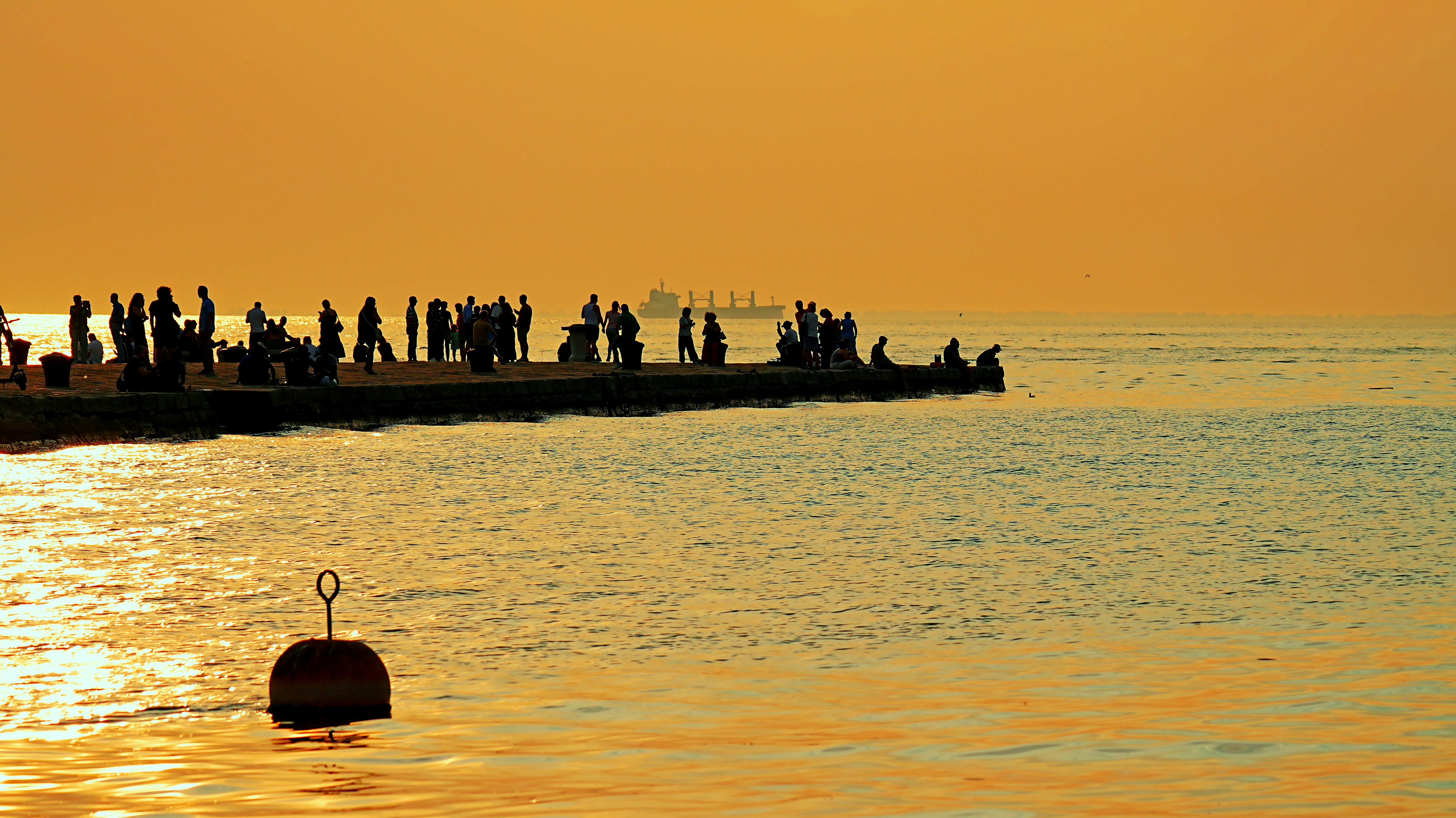 Sunset Silhouettes Over a Quiet Jetty