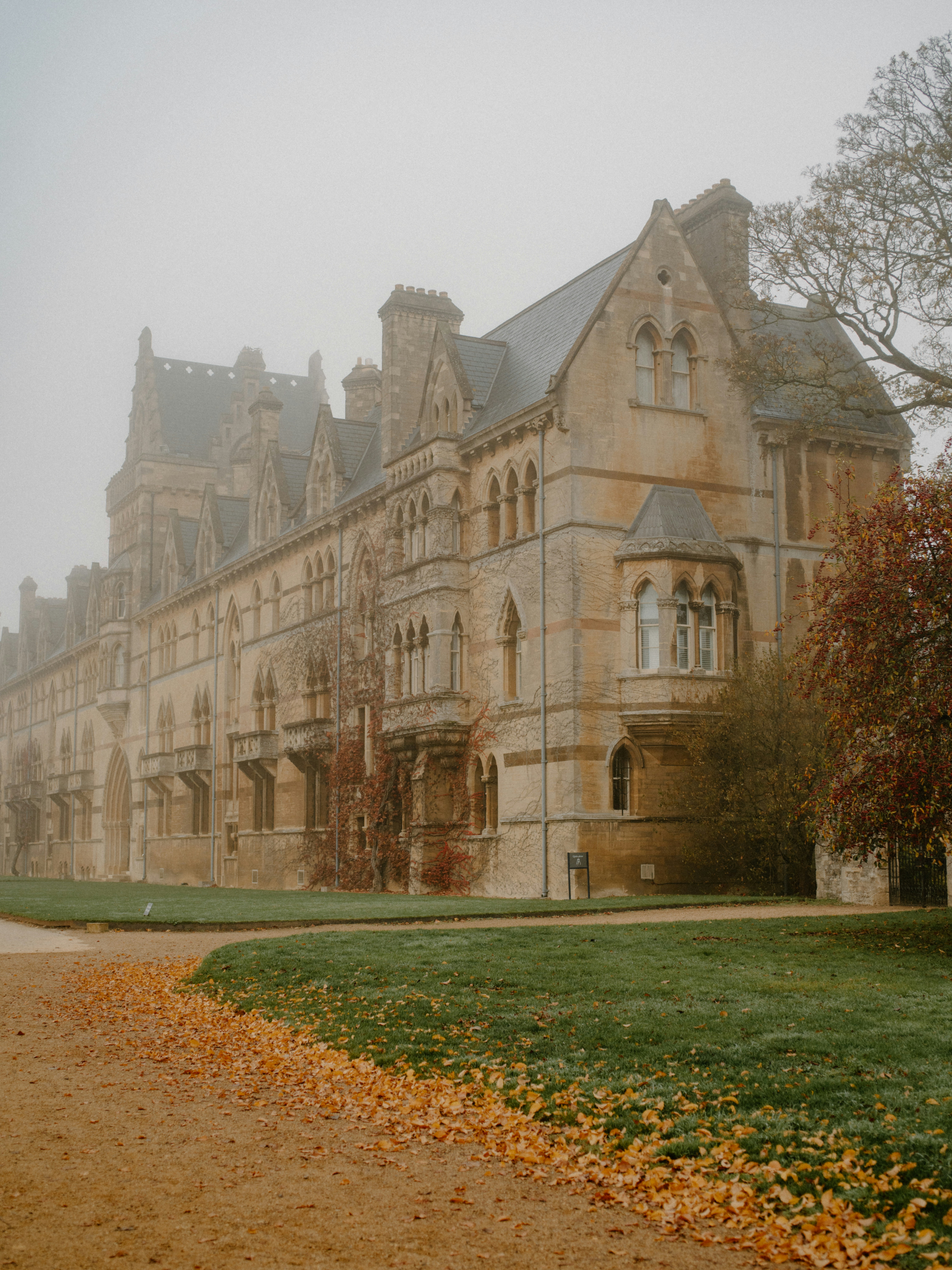 Historic stone building on a foggy autumn day.