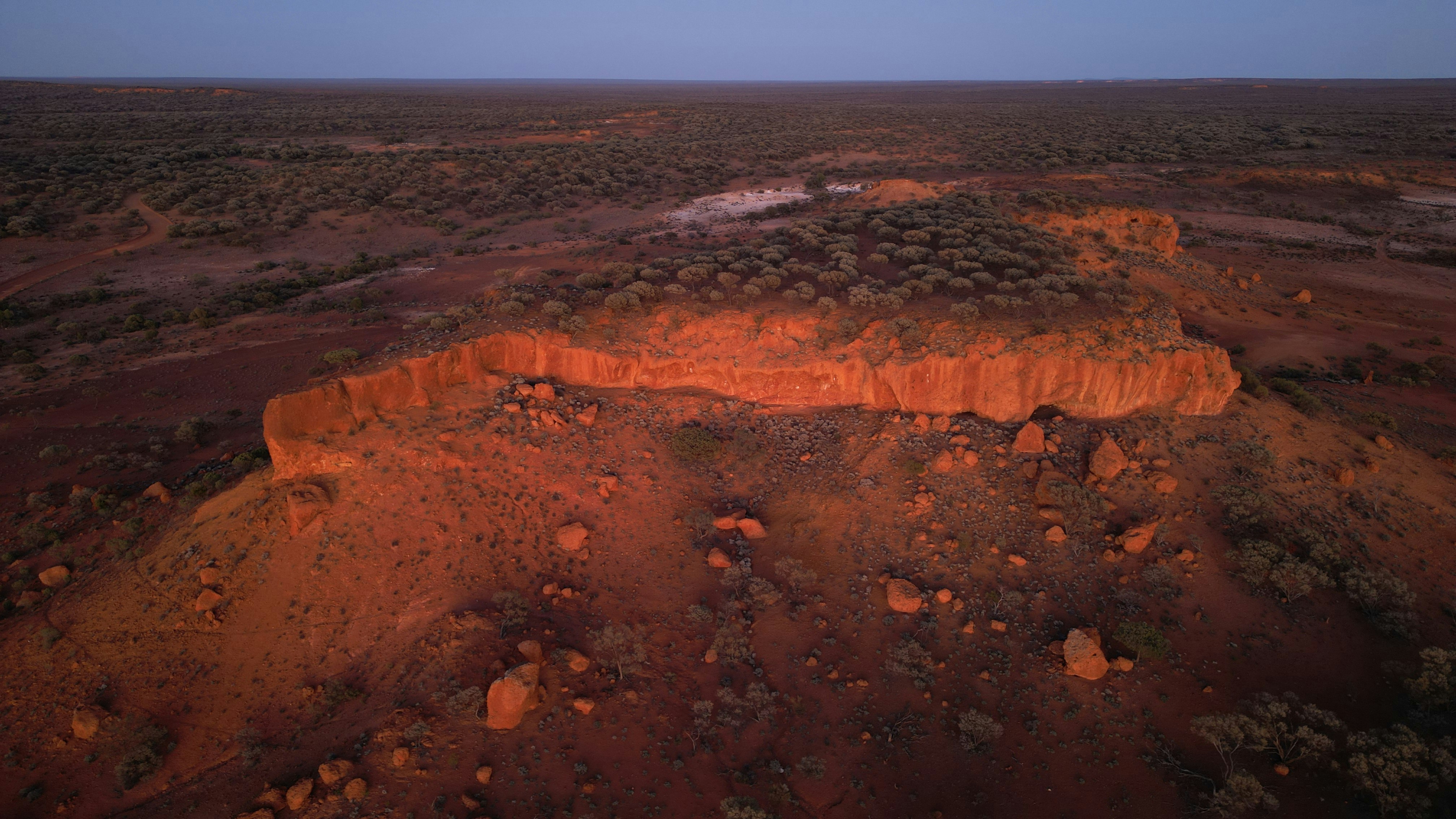 Redstone Crest at Dusk: A Desert Cliff Framing the Flat Horizon