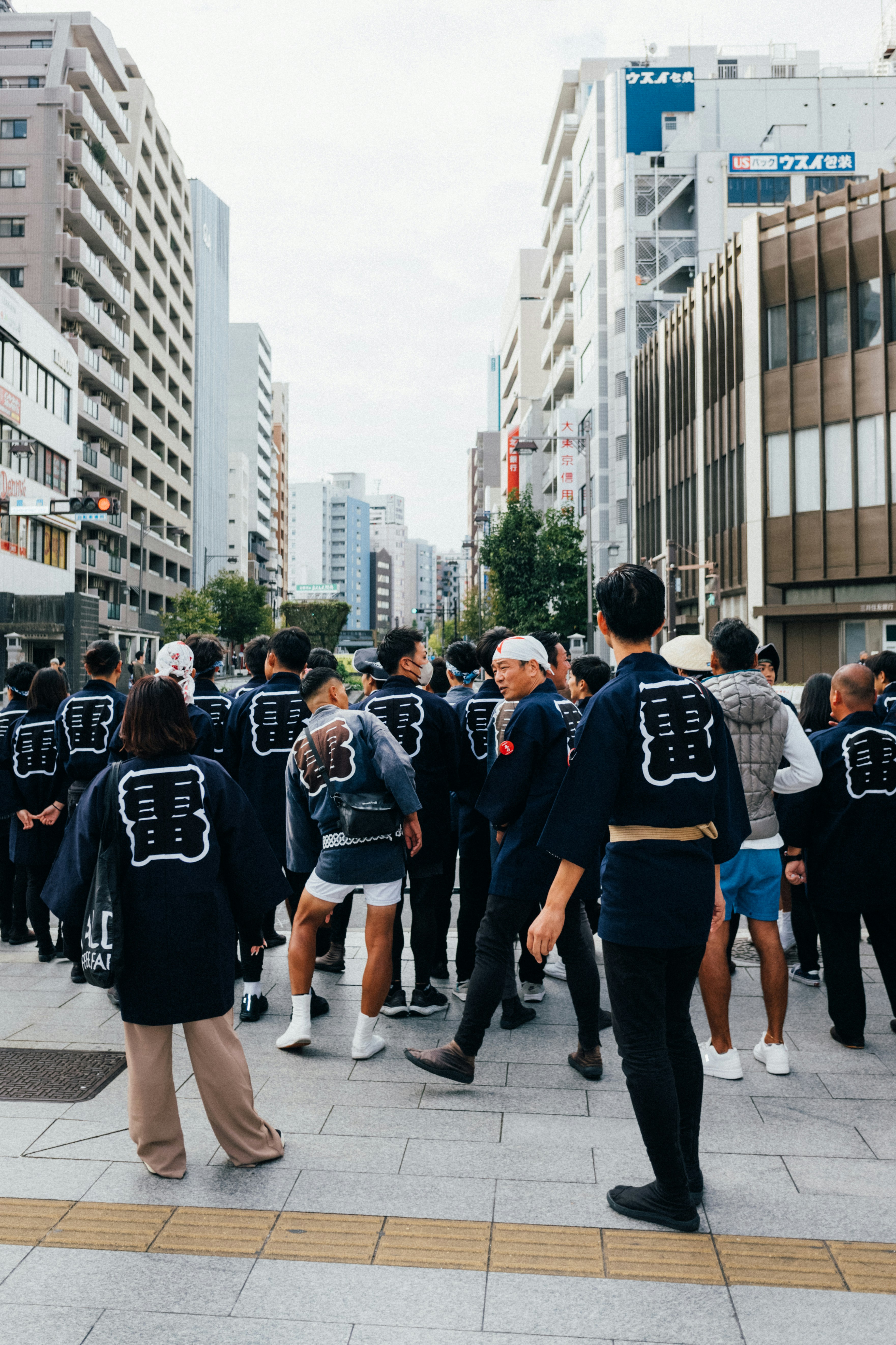 Happi-Coated Crowd Converges on a Bustling City Street