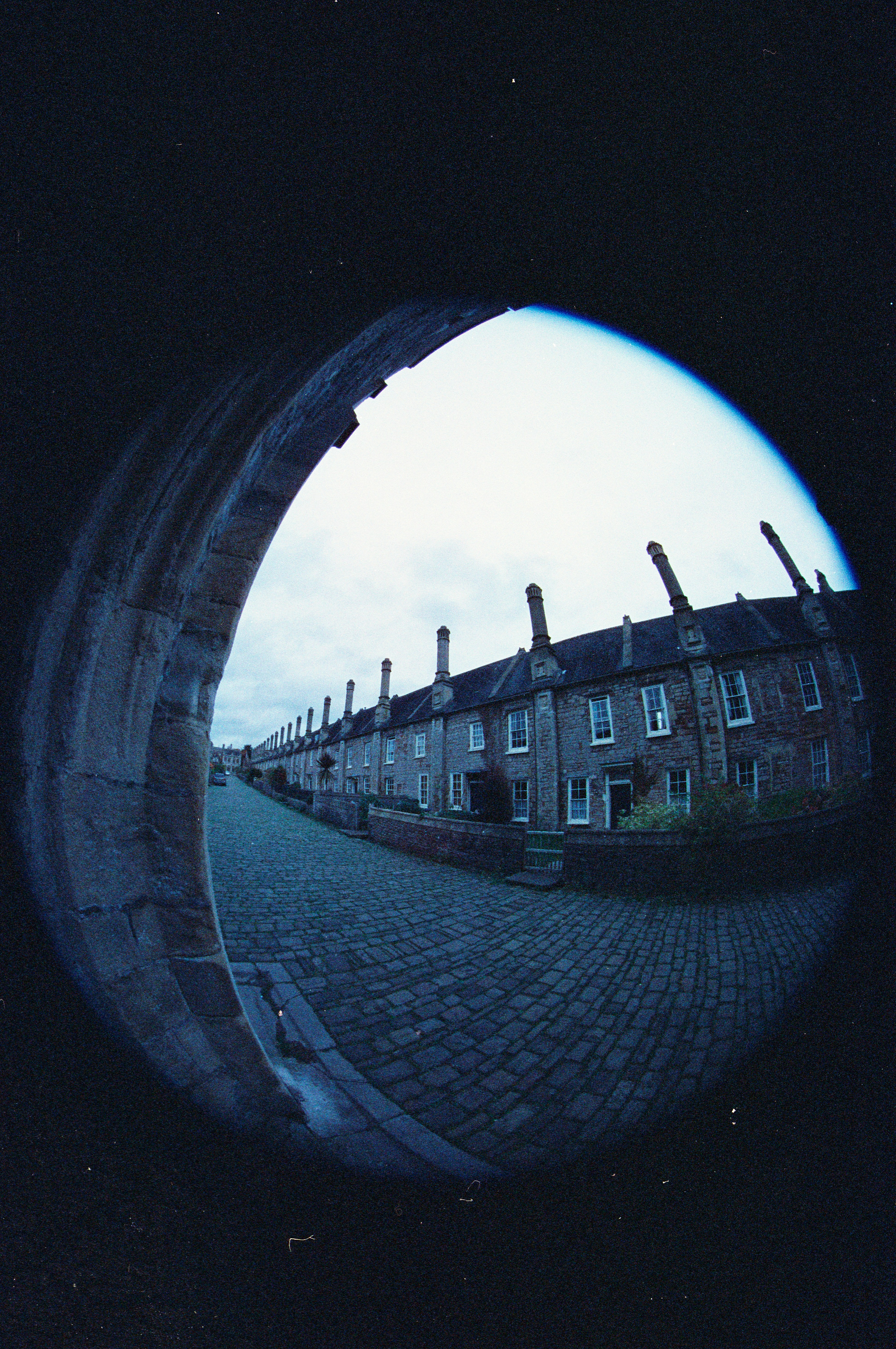 Row of historic houses with cobblestone street