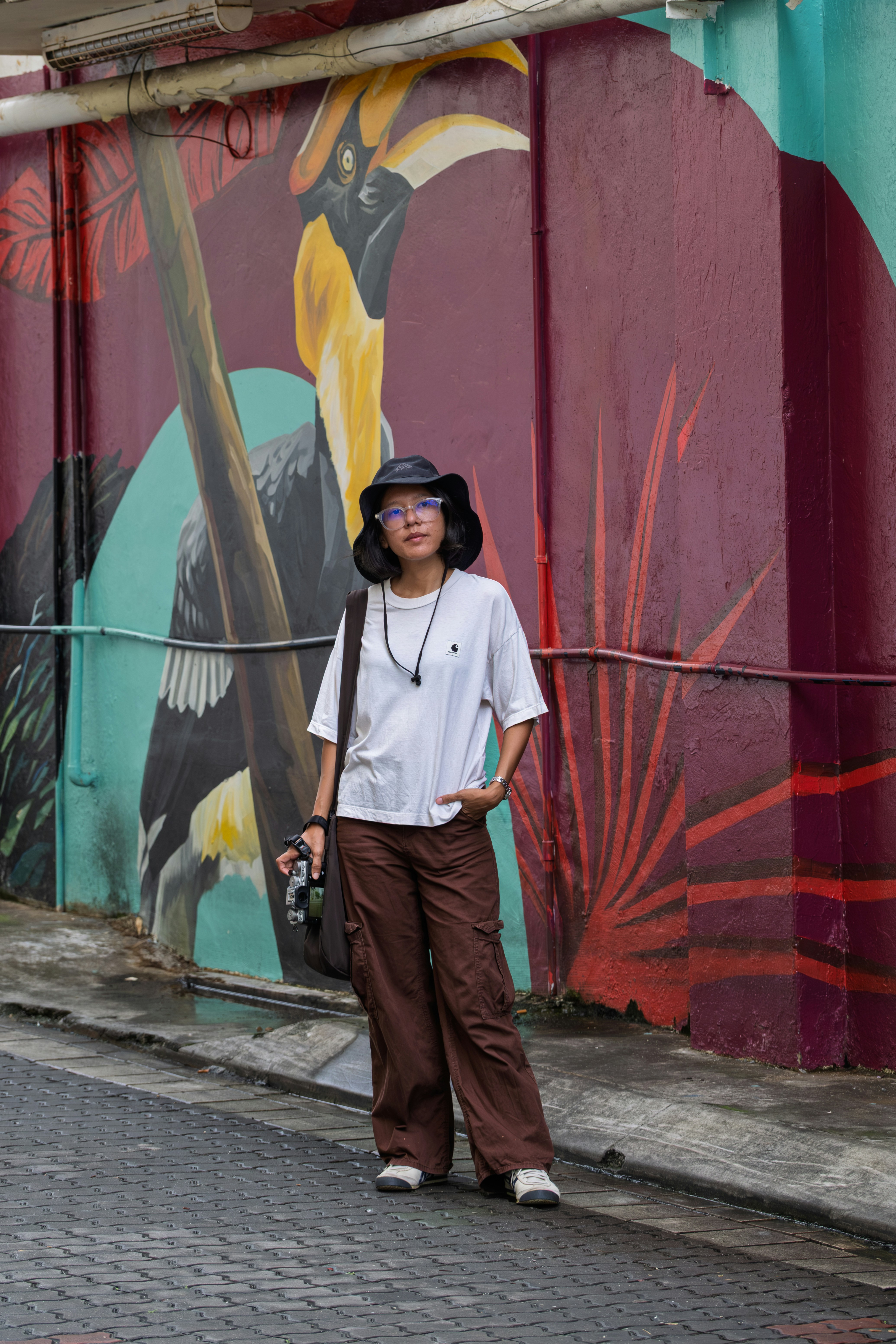 Portrait in Front of a Toucan-Tinted Urban Mural