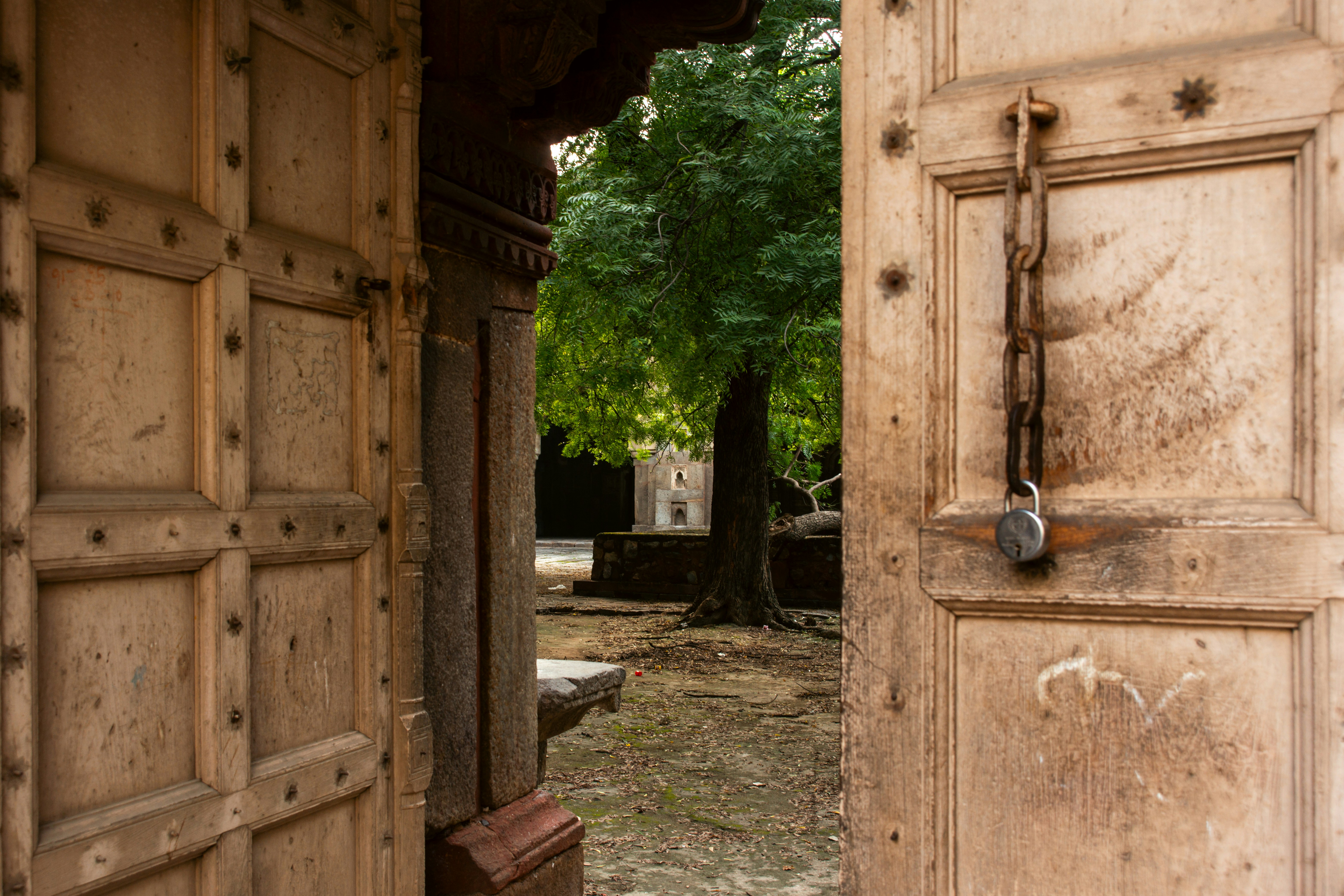 Weathered Gates Framing a Sunlit Courtyard