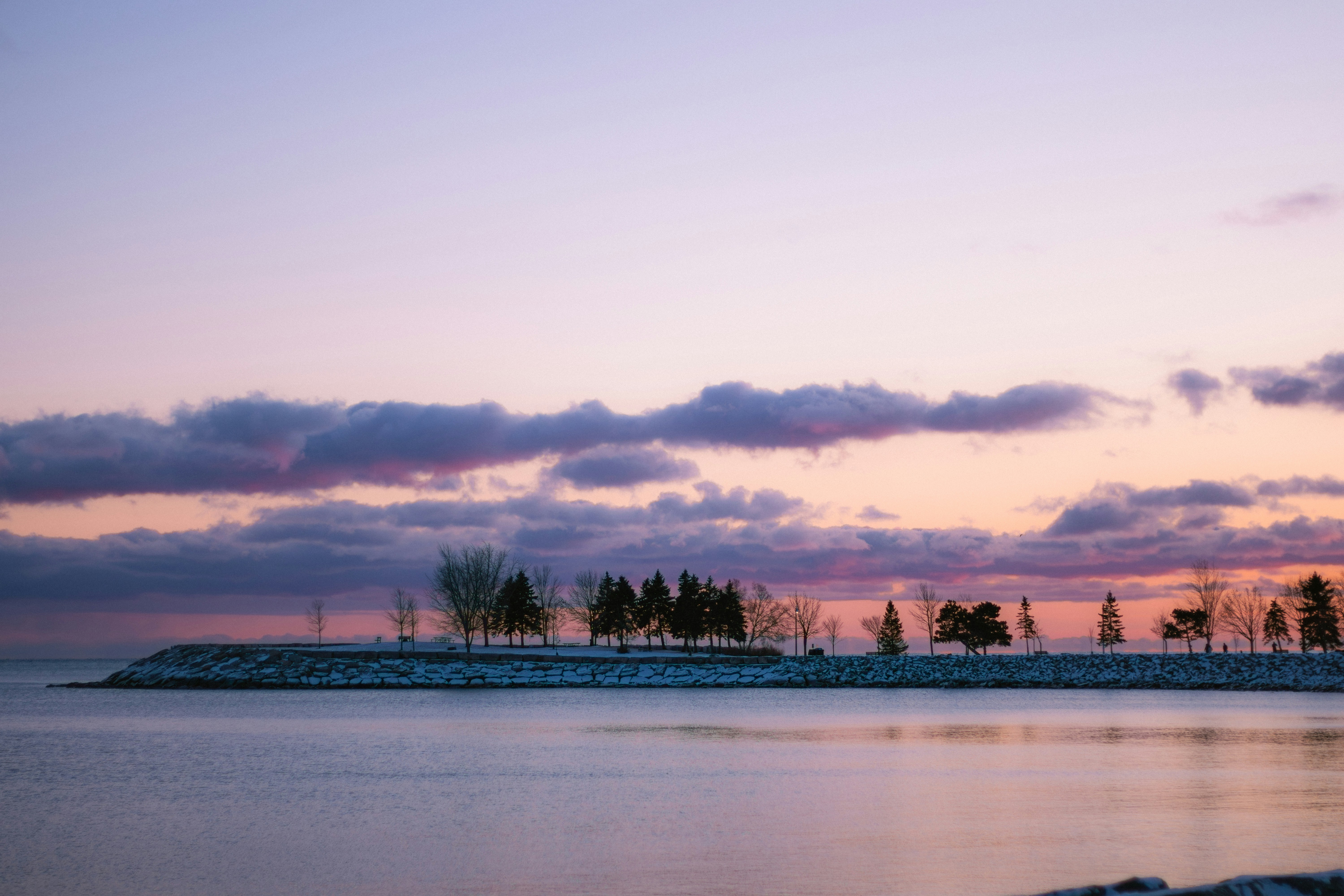 Pretty evening sky over snow covered park