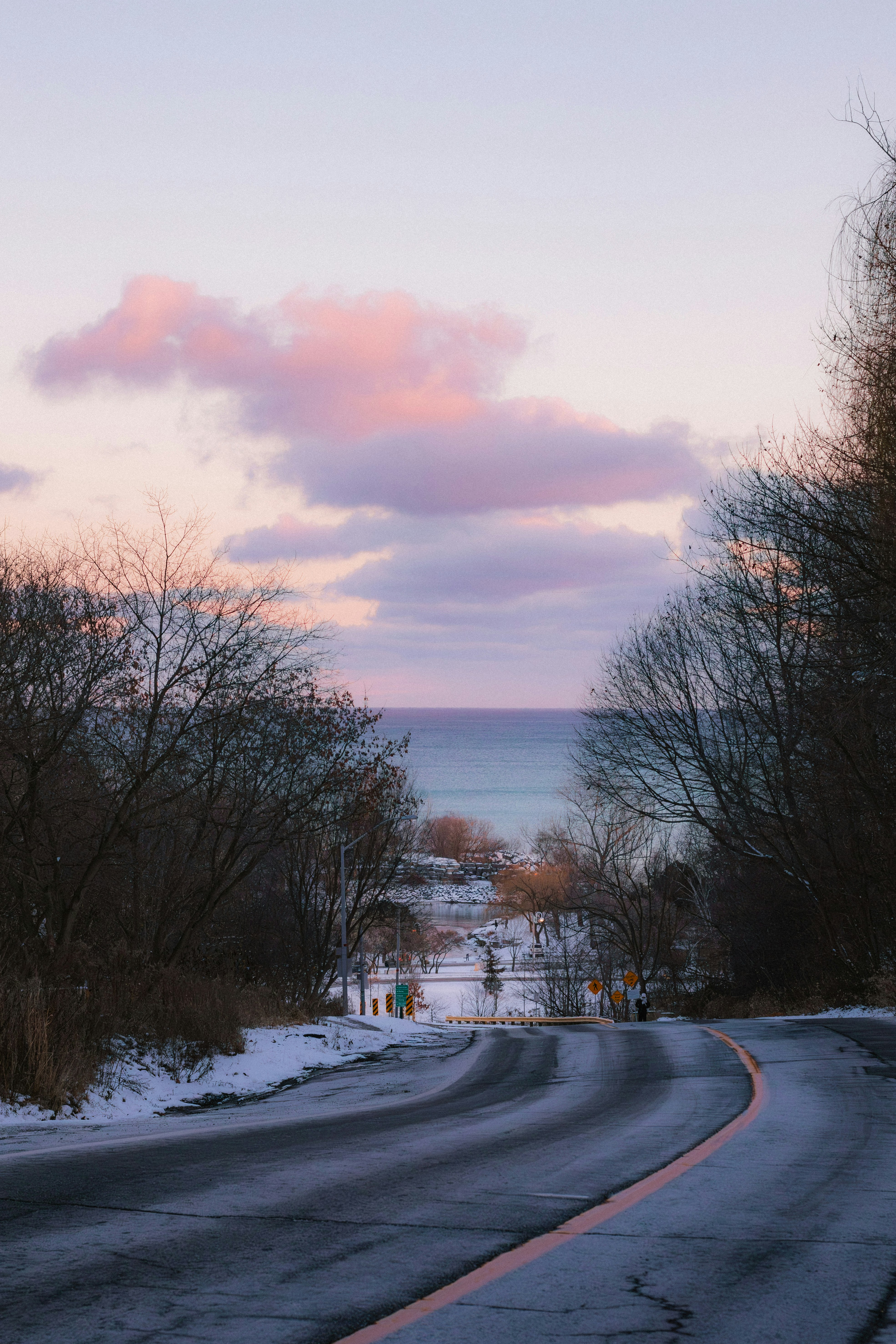 A road leading to the a snow covered beach in Canada