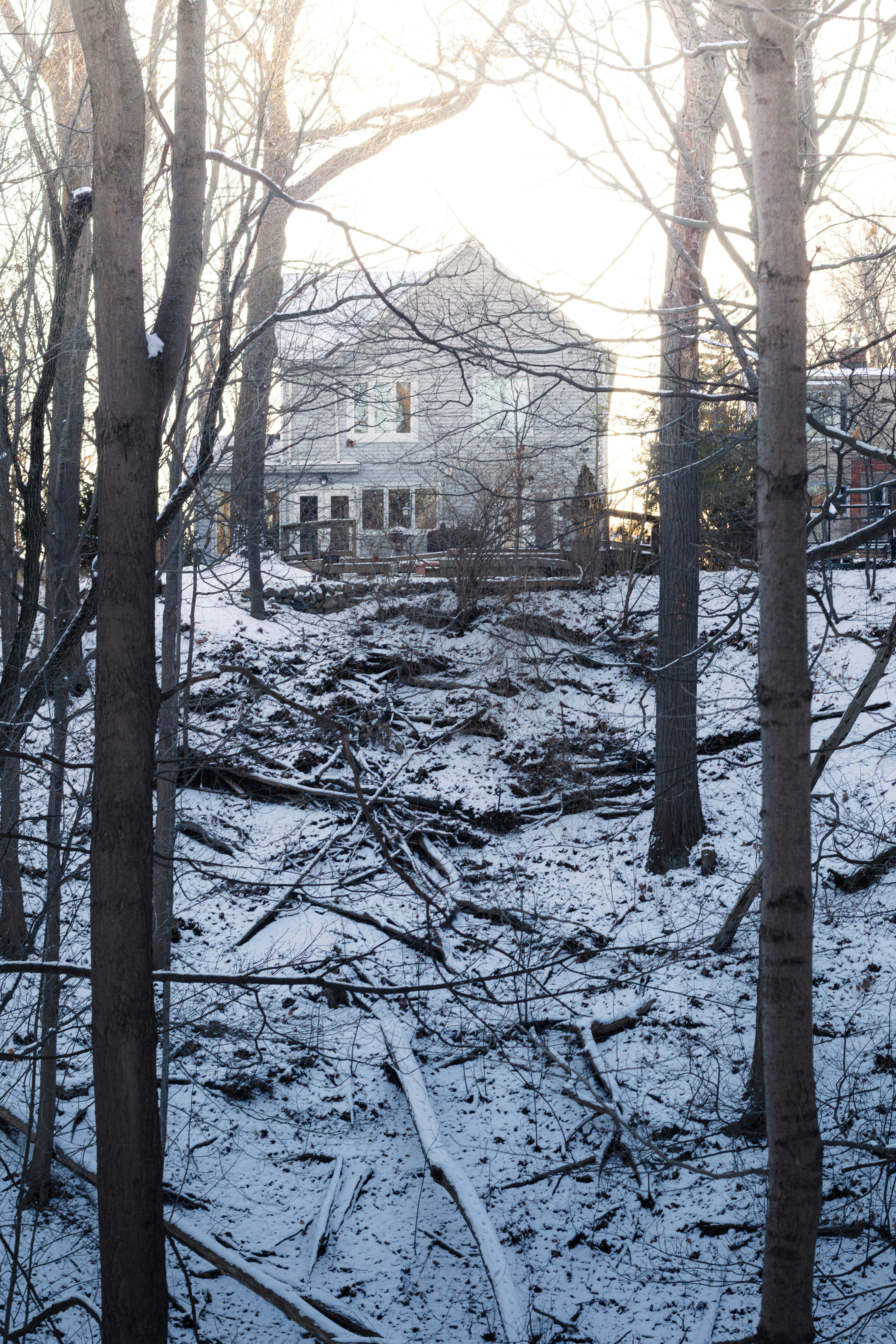 House in distance, covered in snow