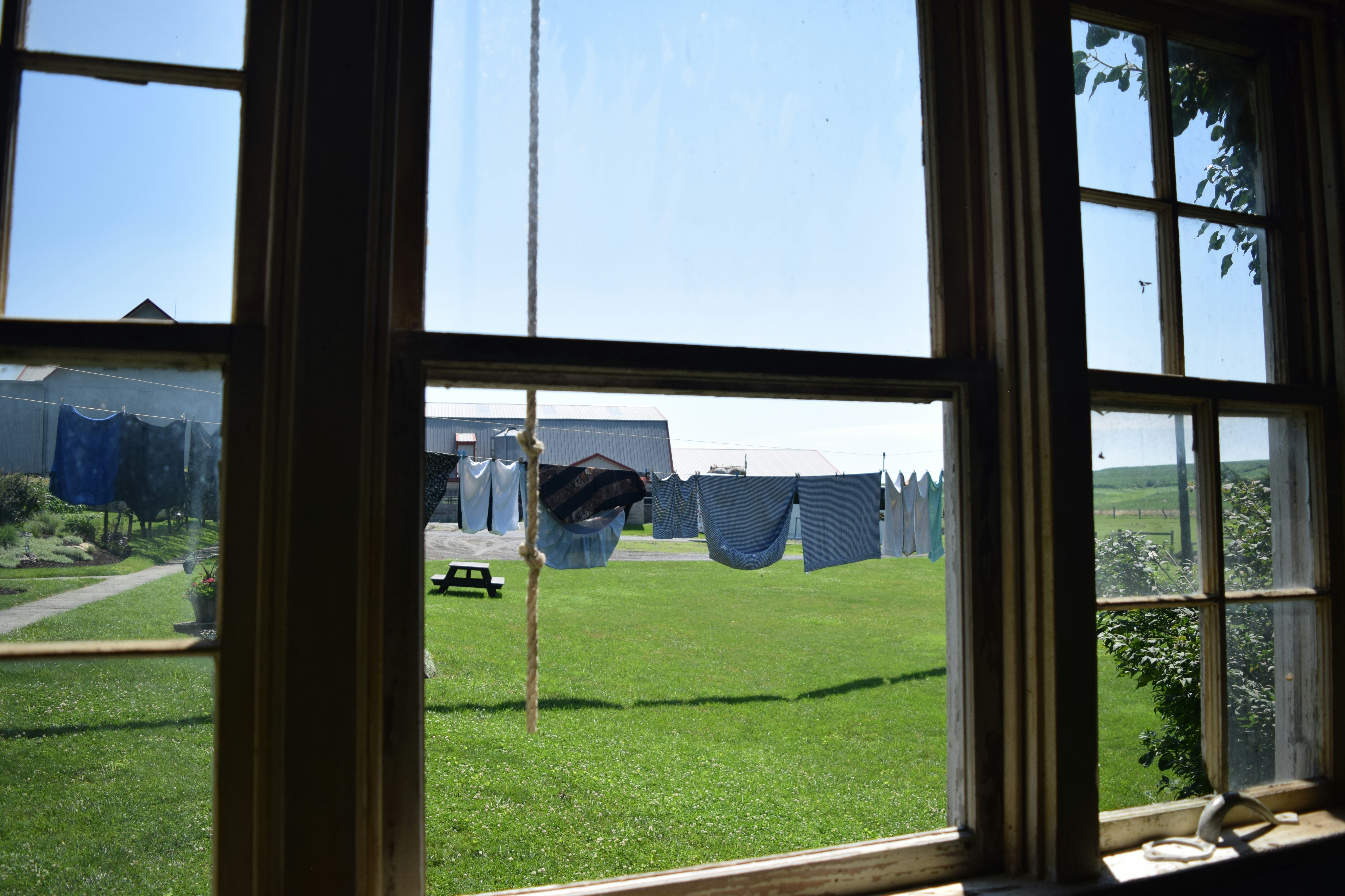 Centerline of Sun: Laundry on a Window-Framed Courtyard