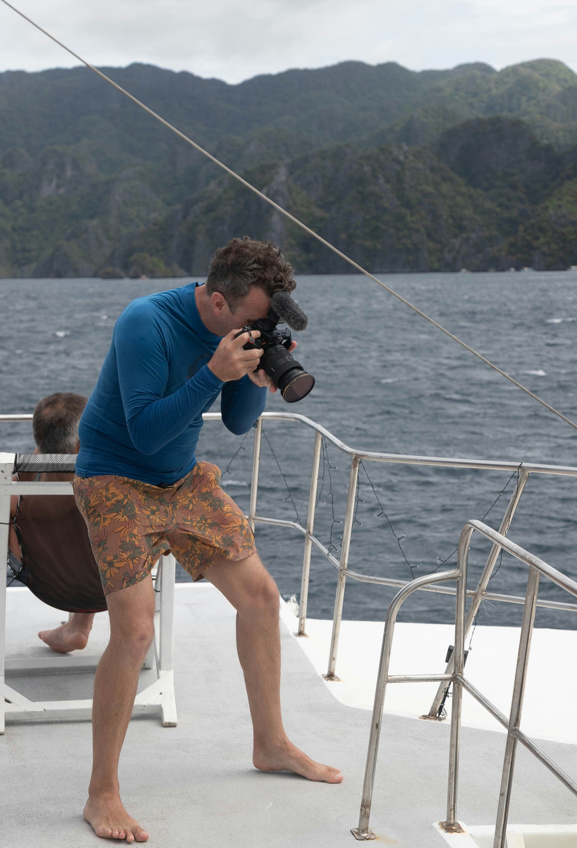 Deckside Motion: A Photographer Captures the Sea-Cliff Backdrop