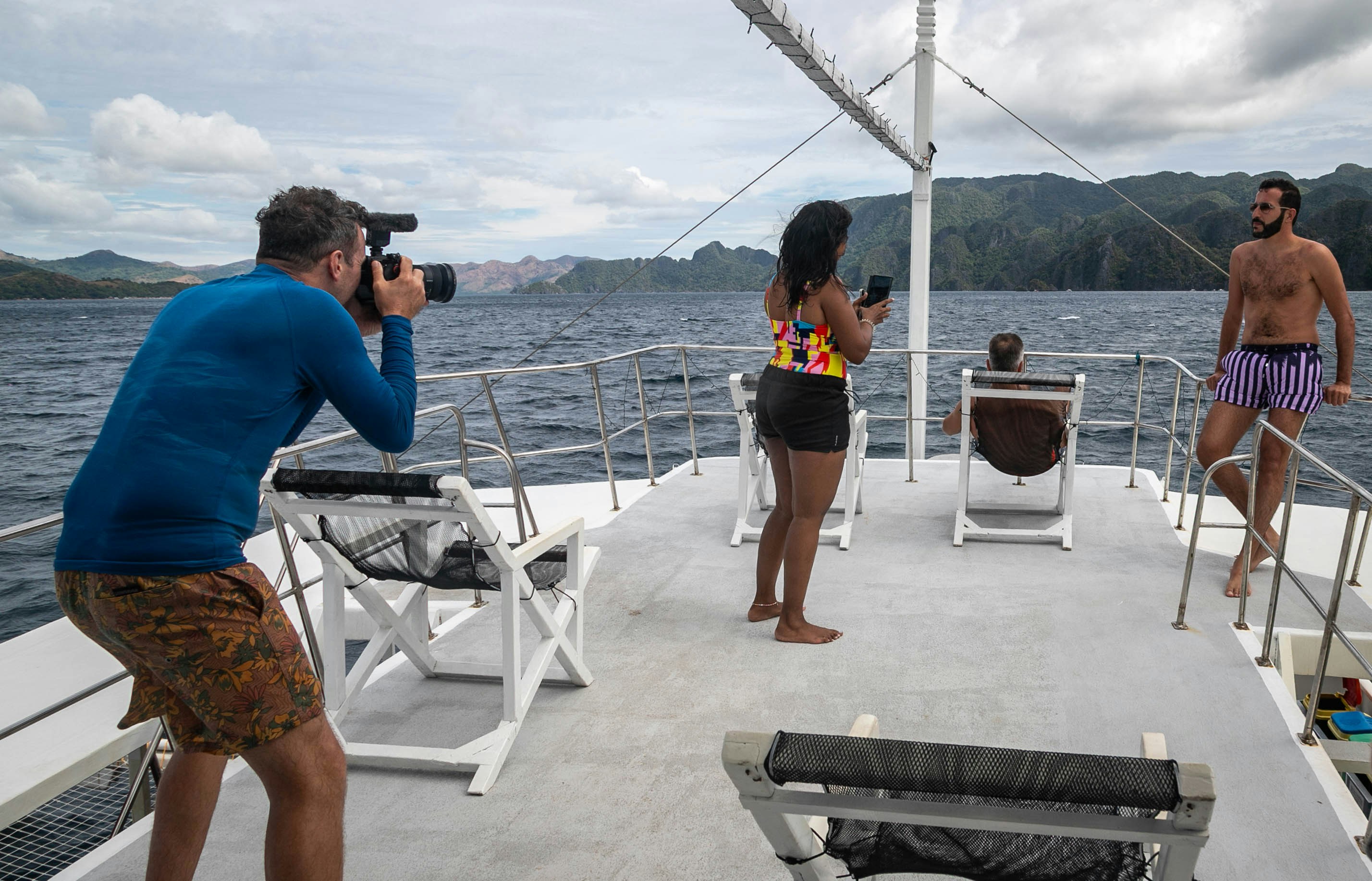 Deckside Portraits at Sea: A Photographer, a Colorful Top, and the Open Water