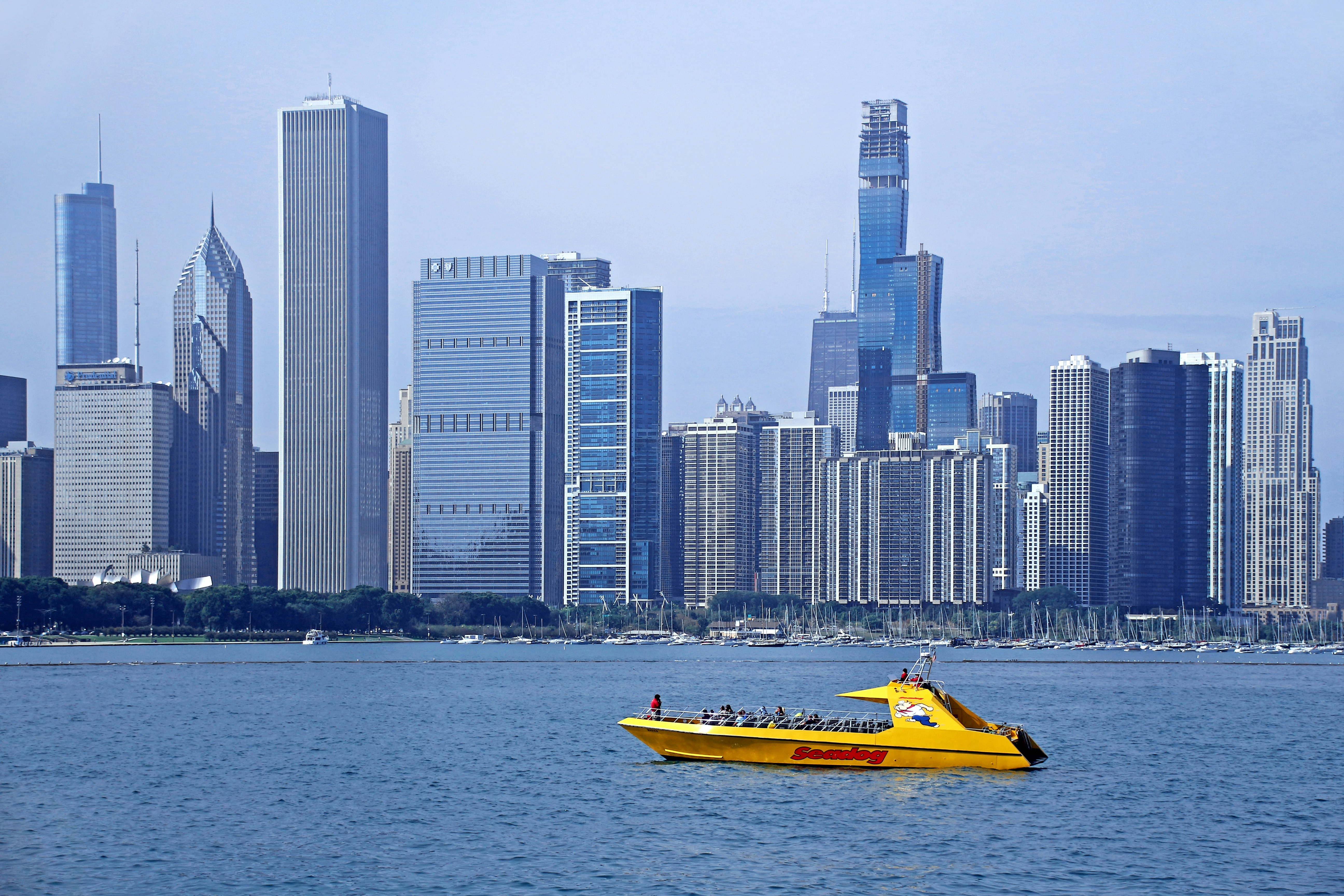 Yellow Runabout Skims Lake as Chicago's Glass Skyline Rises