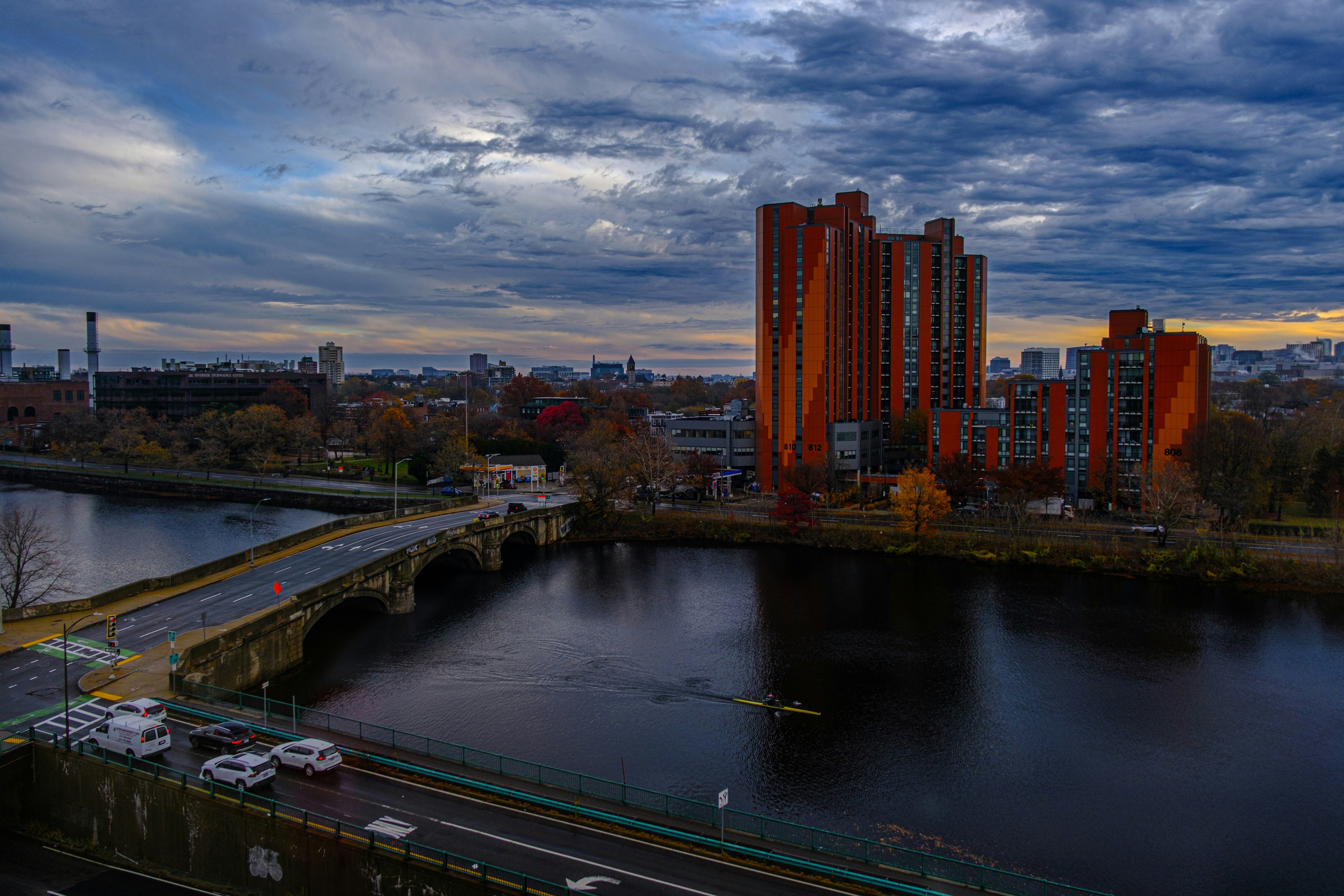Brick-Orange Skyline Cast in Twilight Over a Calm River