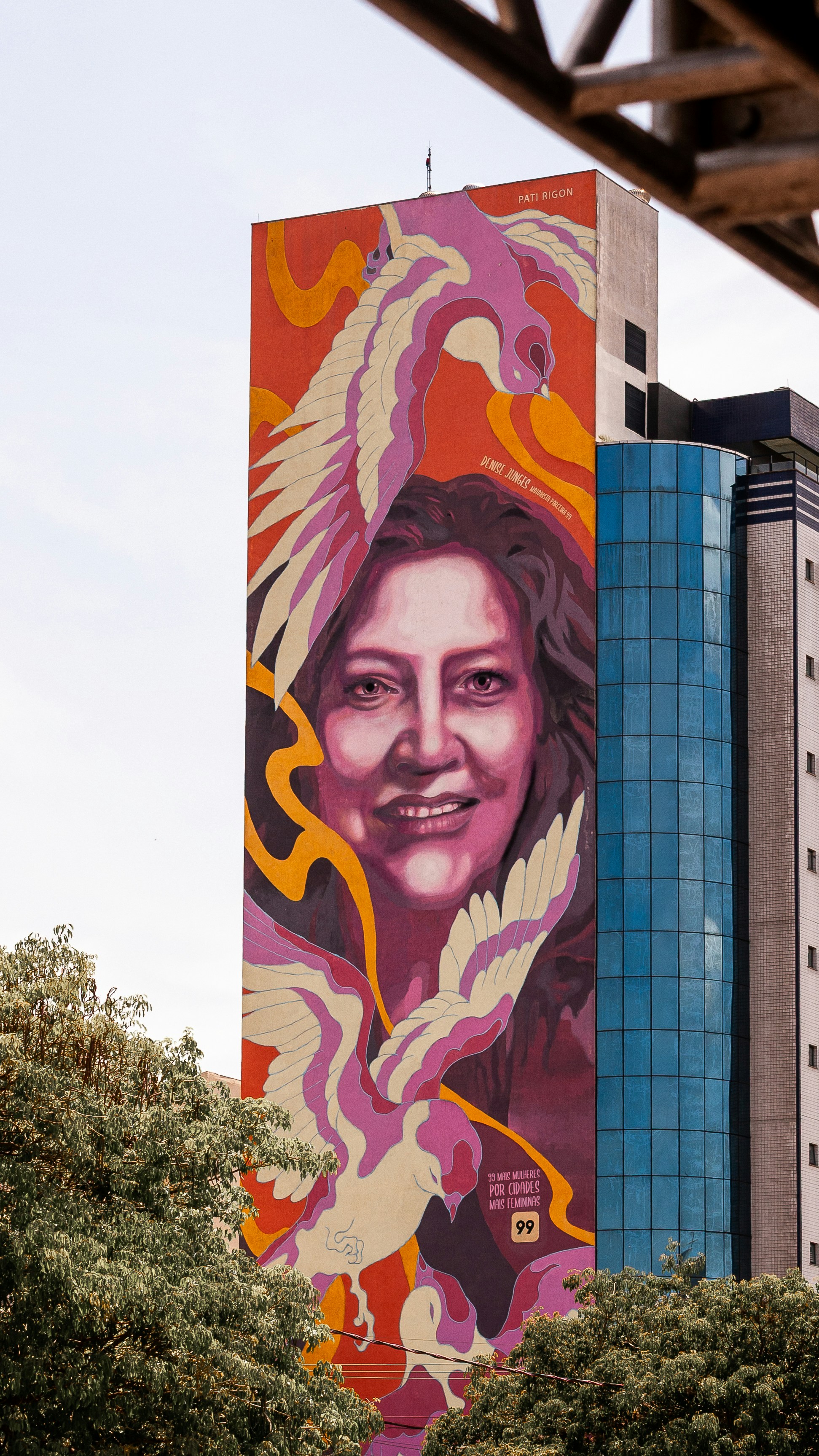 Portrait on the Tower: A Smiling Face Among Painted Birds