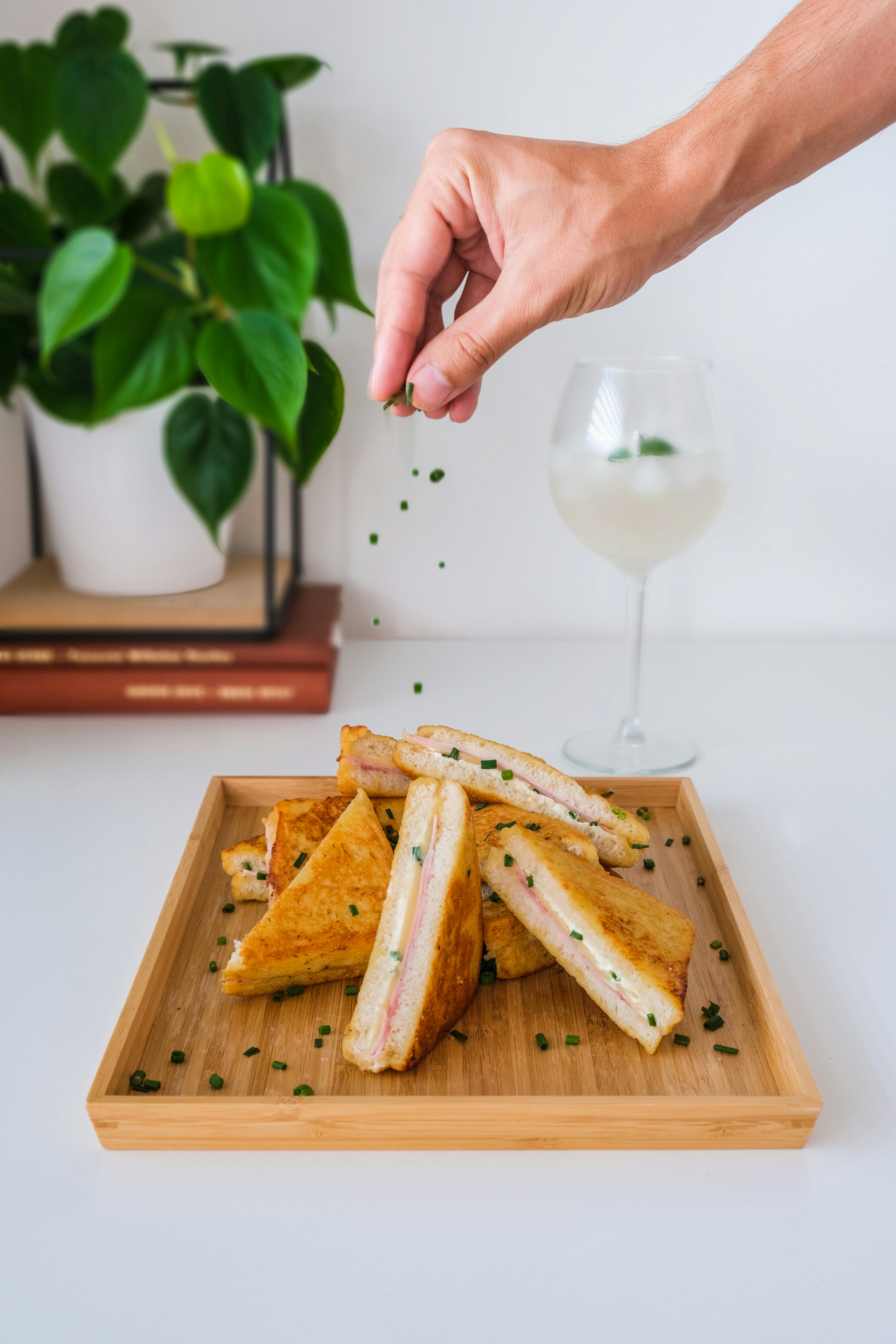 Chive Cascade Over Golden Ham Sandwich Triangles