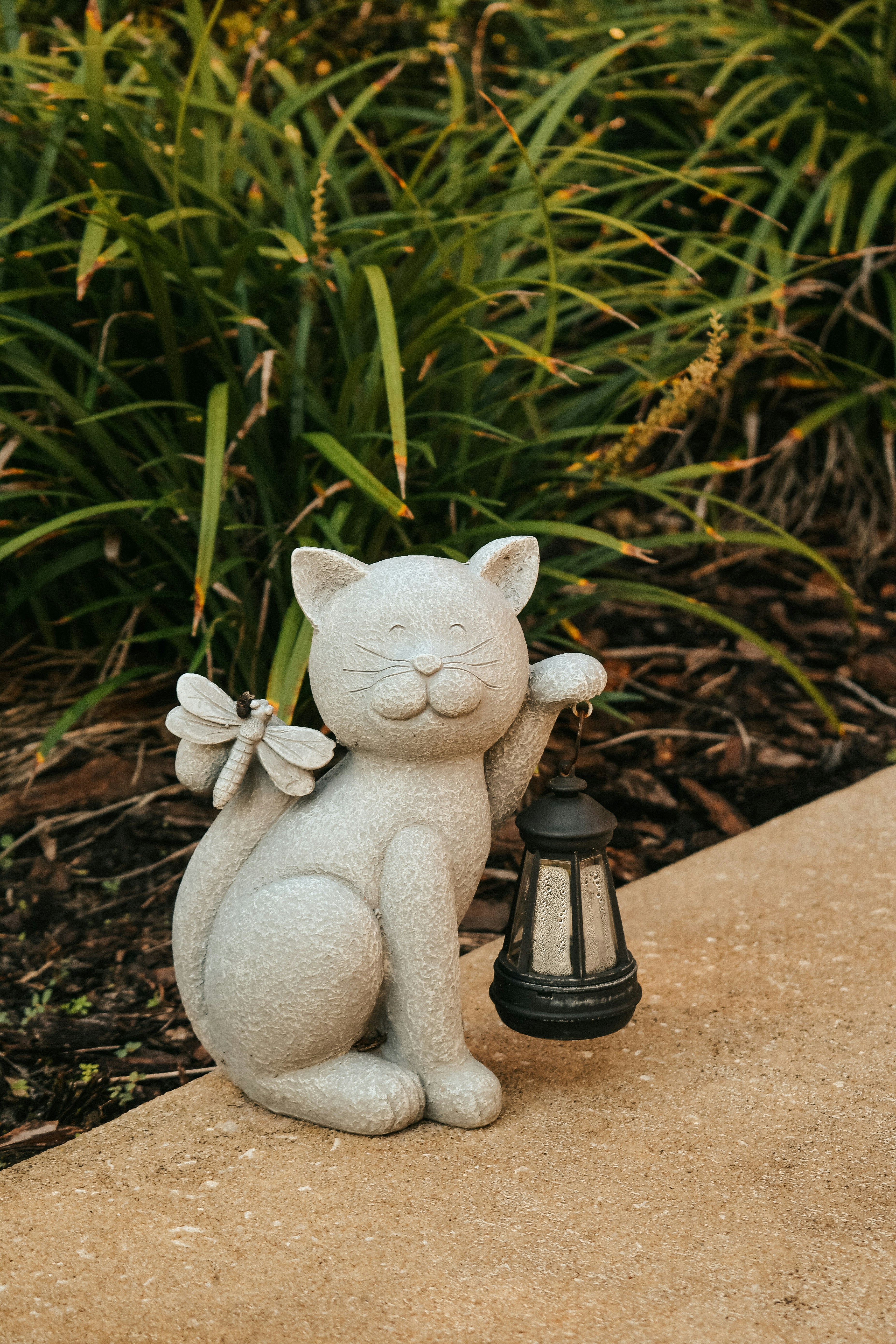 Whiskered Lantern Keeper: A Stone Cat by the Garden Path