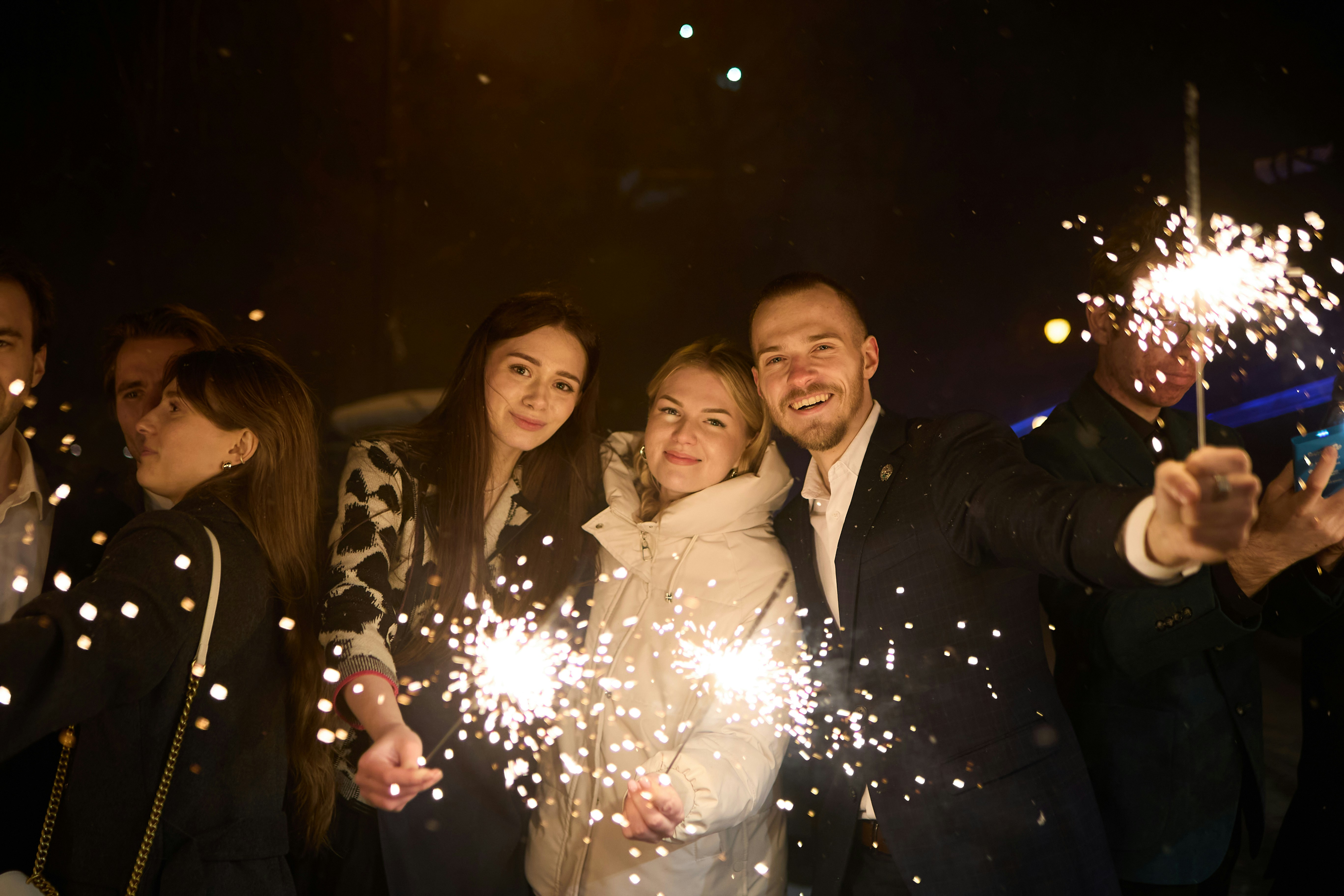 Sparks and Smiles: Nighttime Celebration with Friends