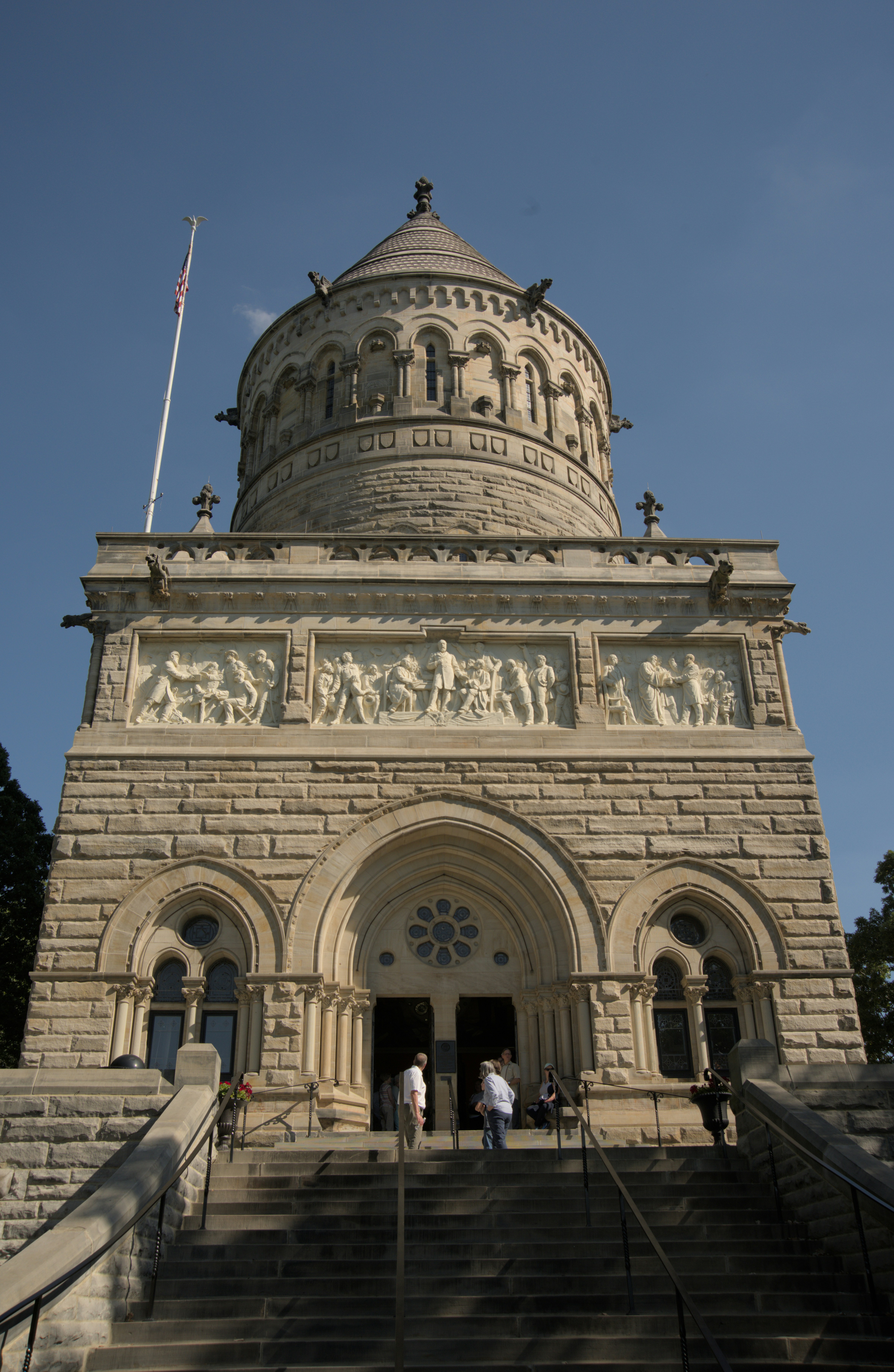 Relief-Lined Facade with a Domed Tower Against a Clear Blue Sky