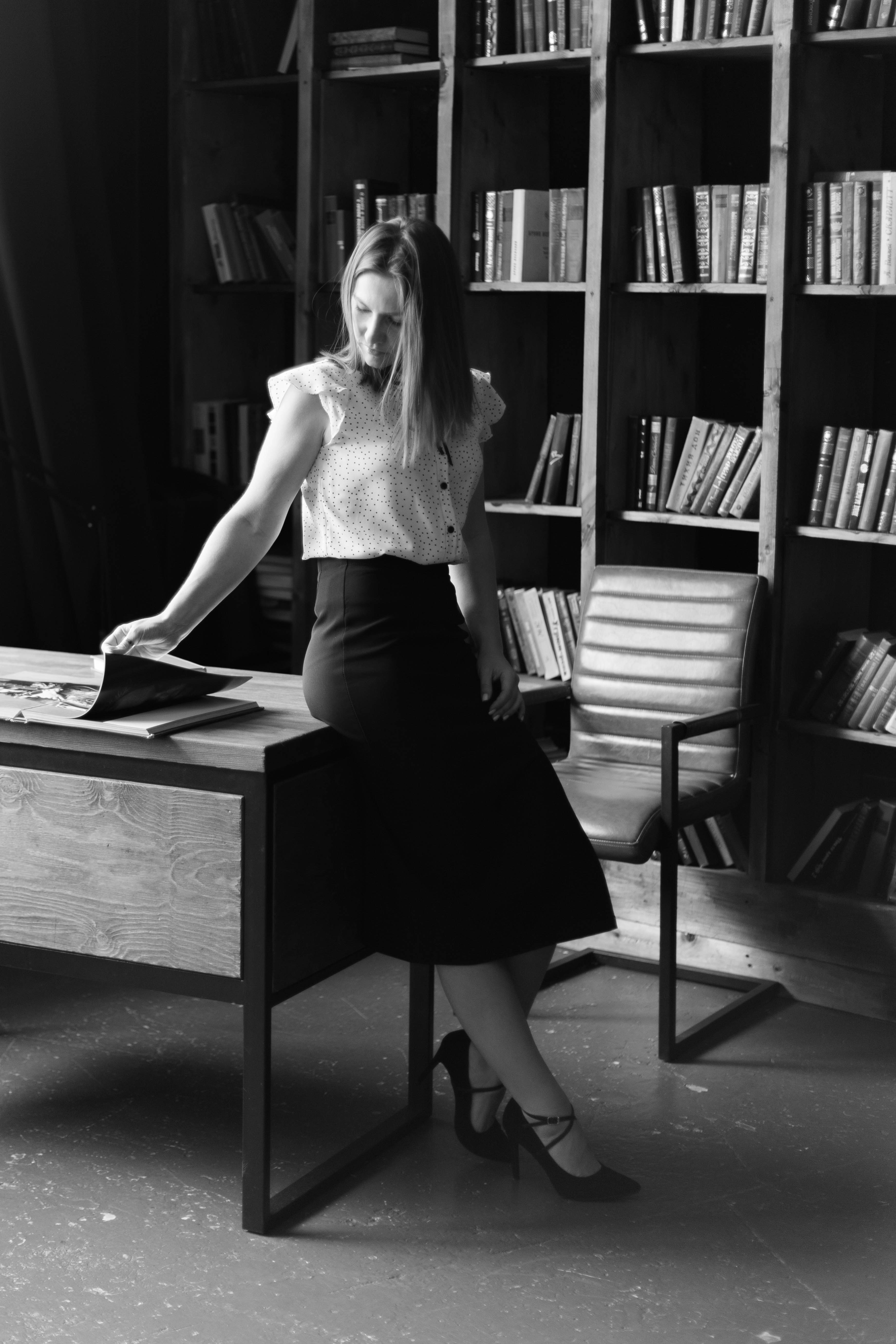 Monochrome Quiet: A Portrait at the Library Desk