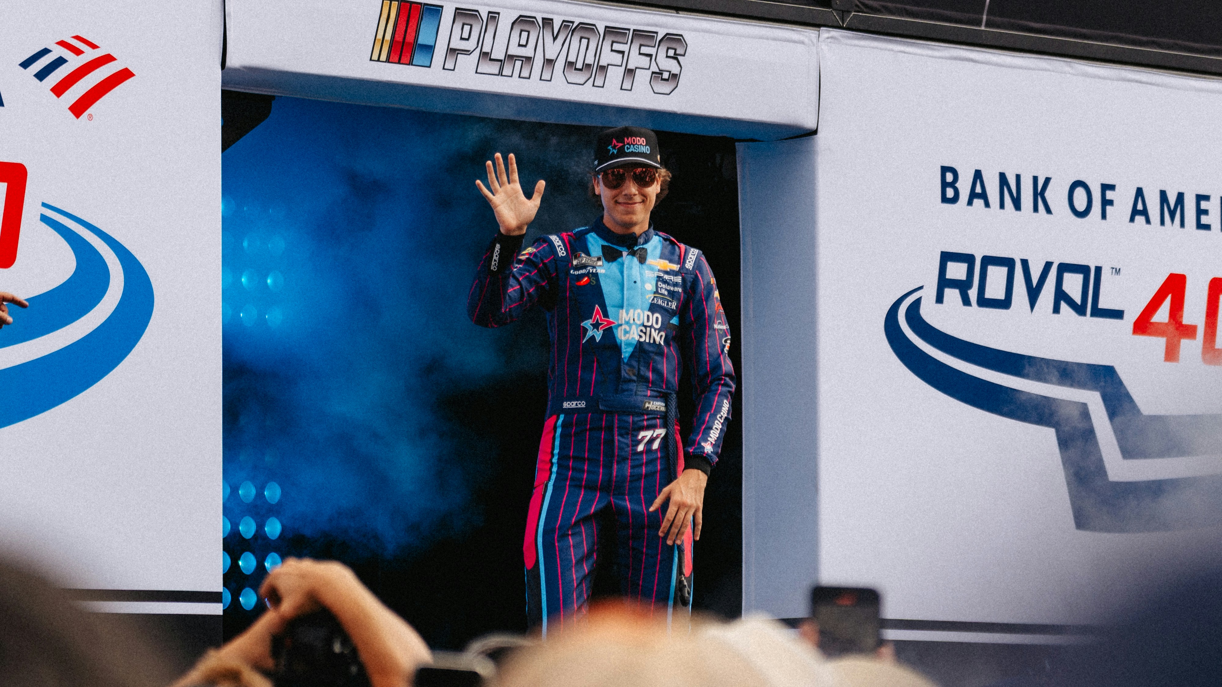 Waving from the Playoffs Gate: A Race-Suit Emerges Onto the Stage