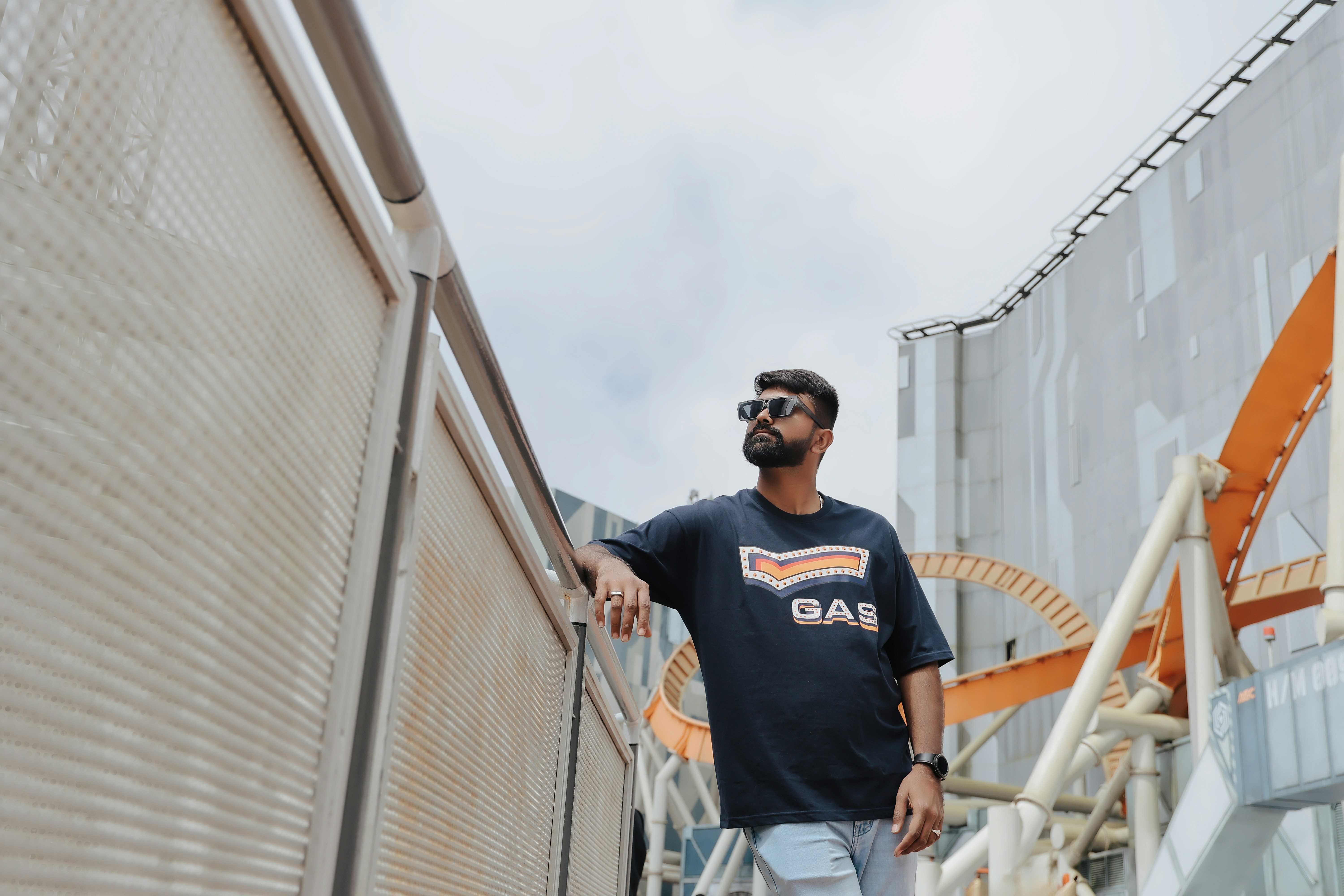 Wanderer on the Catwalk: Portrait Under Orange Scaffolding