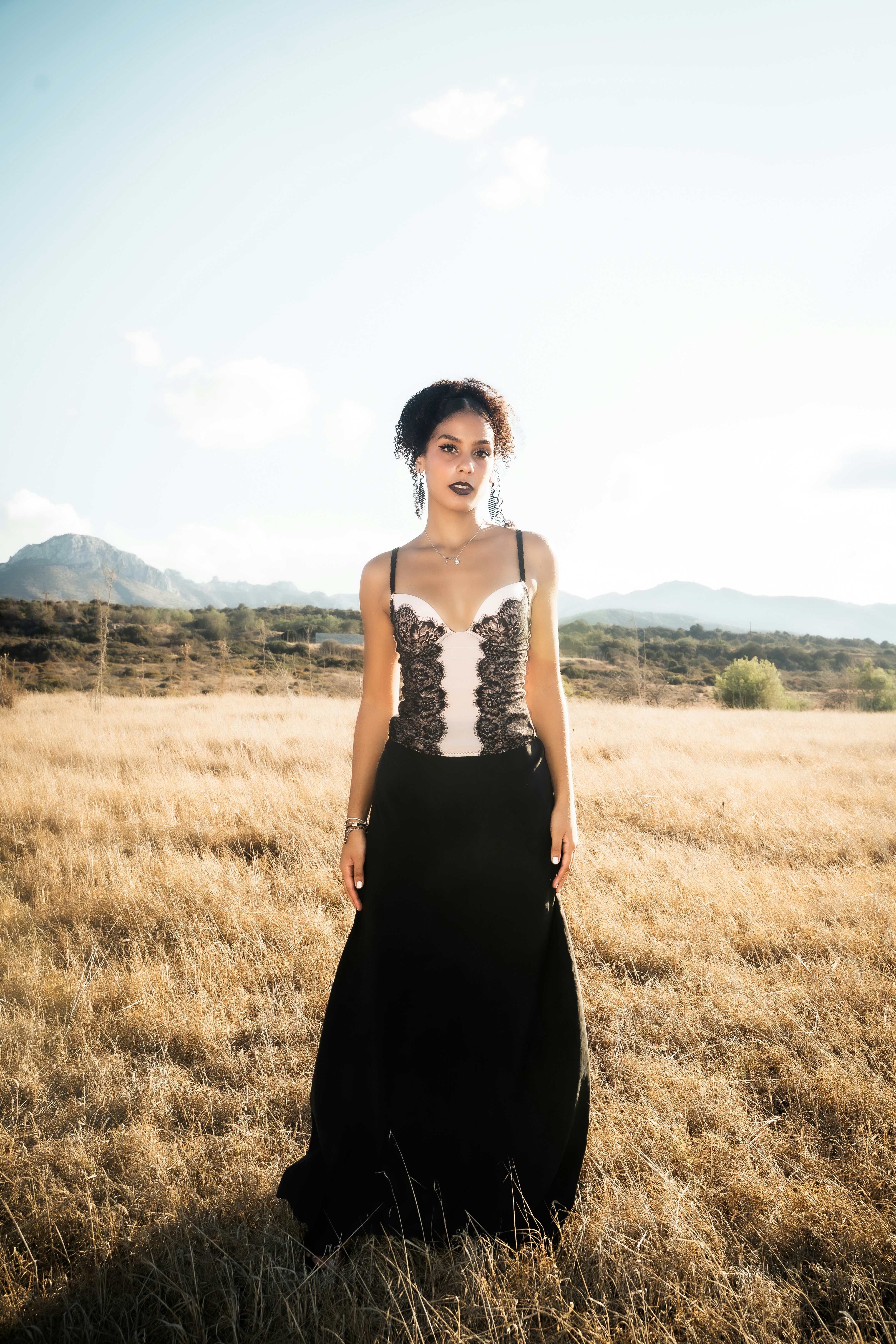 Sundrenched Silk: Portrait Amid Wheat and Distant Peaks